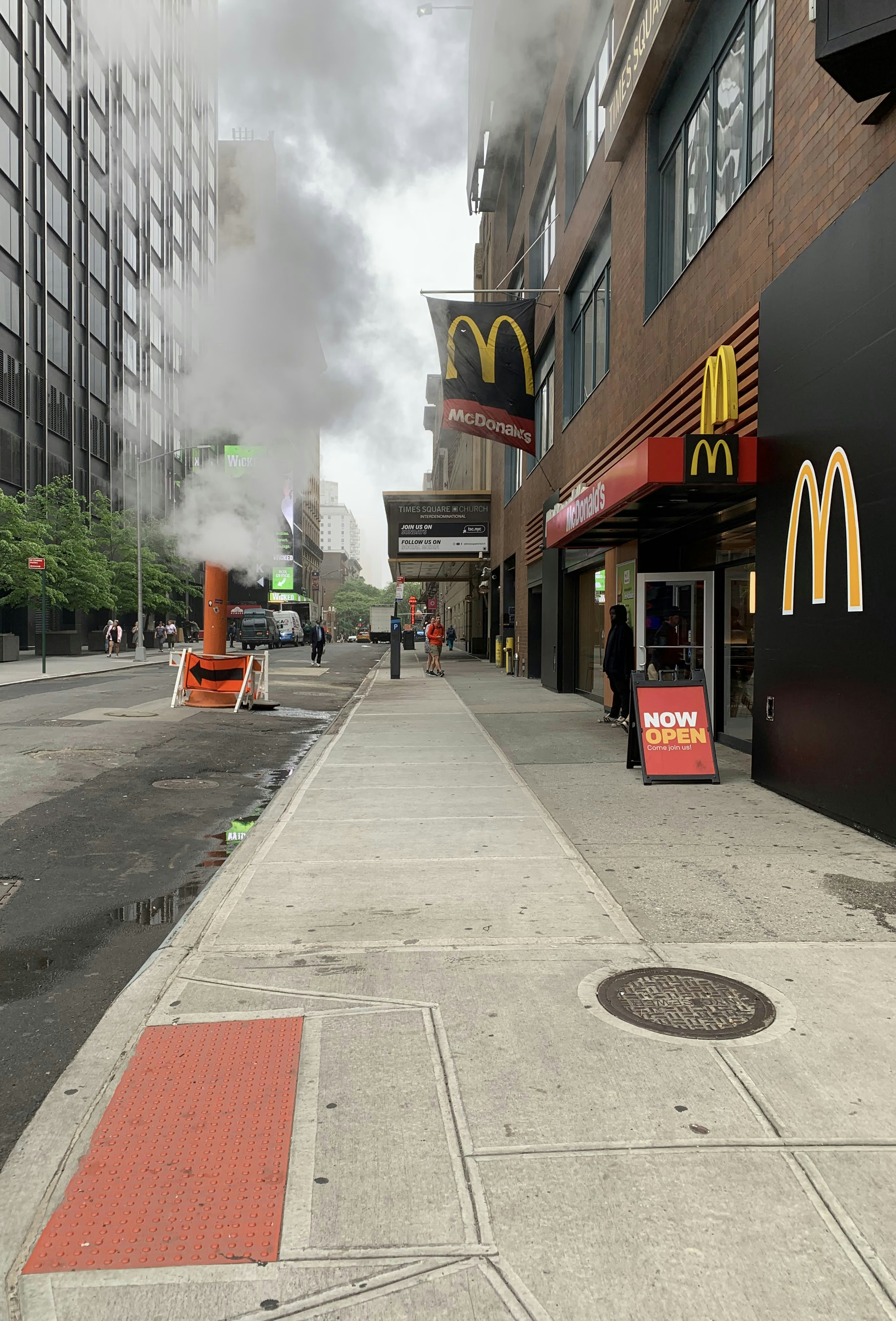 Steam and Golden Arches: A City Block in Motion