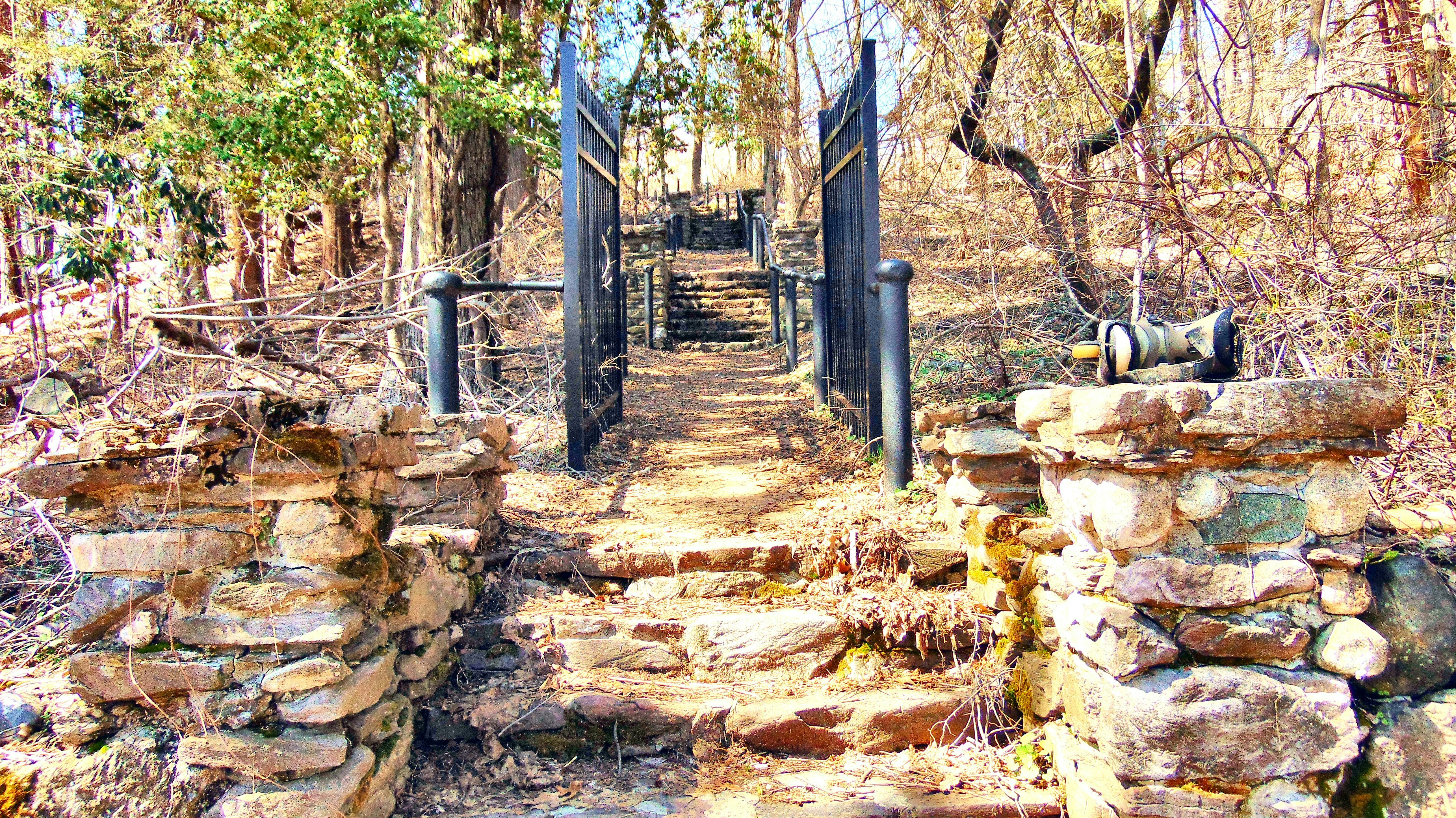A set of stone steps leading to a set of gates photo – Free Gate Image ...