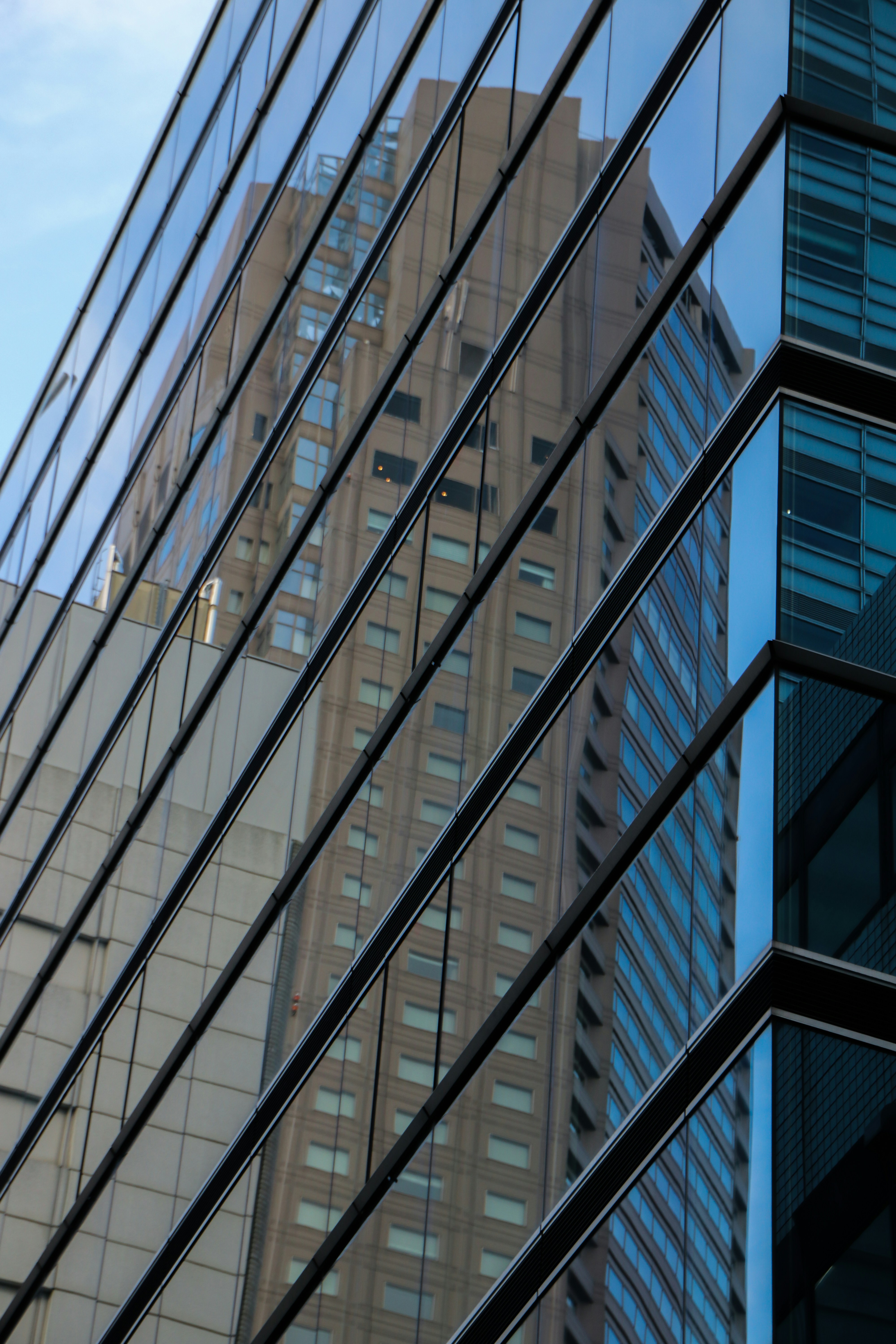 The reflection of a building in the windows of another building photo ...