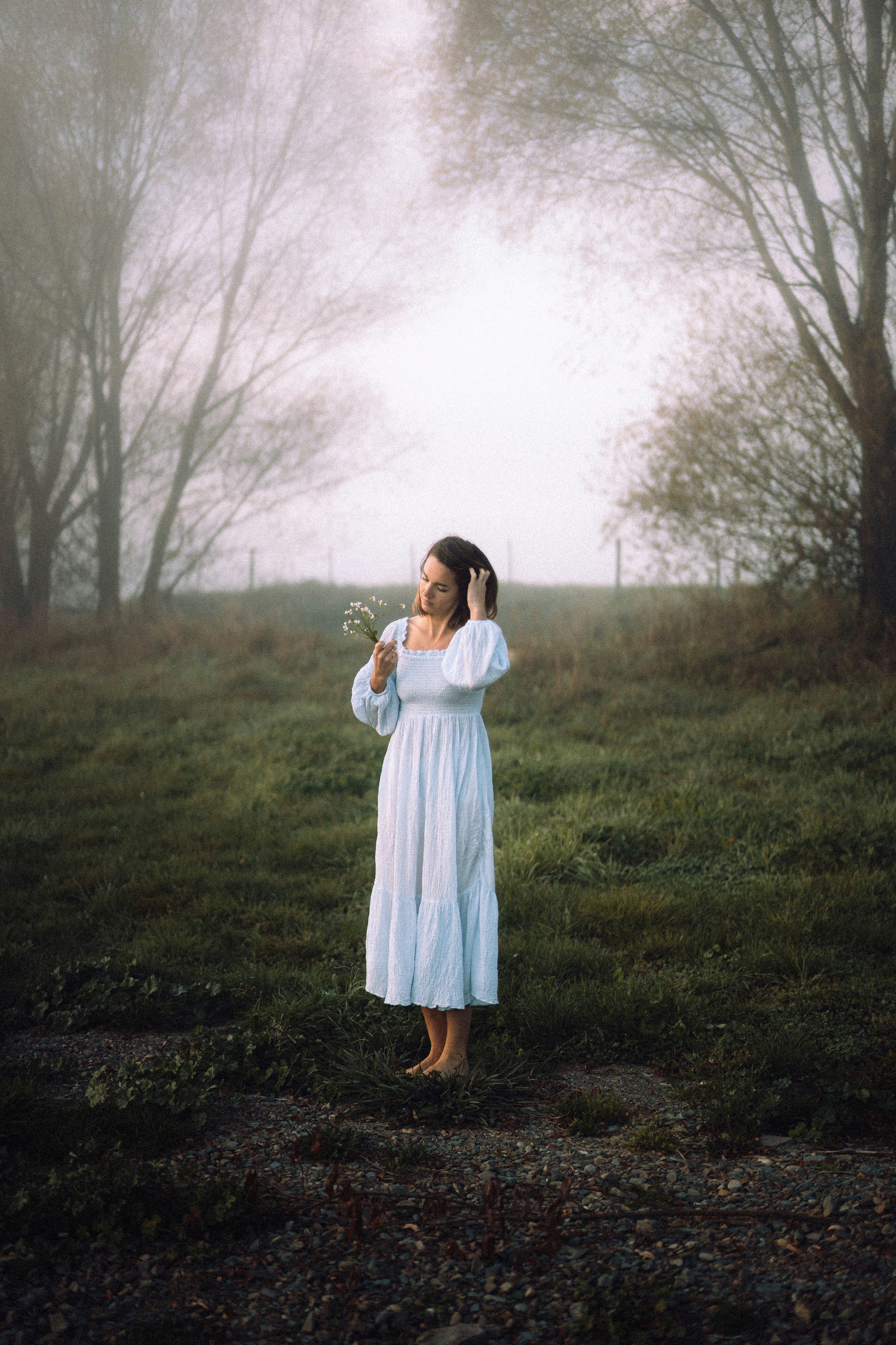 A woman in a white dress standing in a field photo – Free New zealand ...