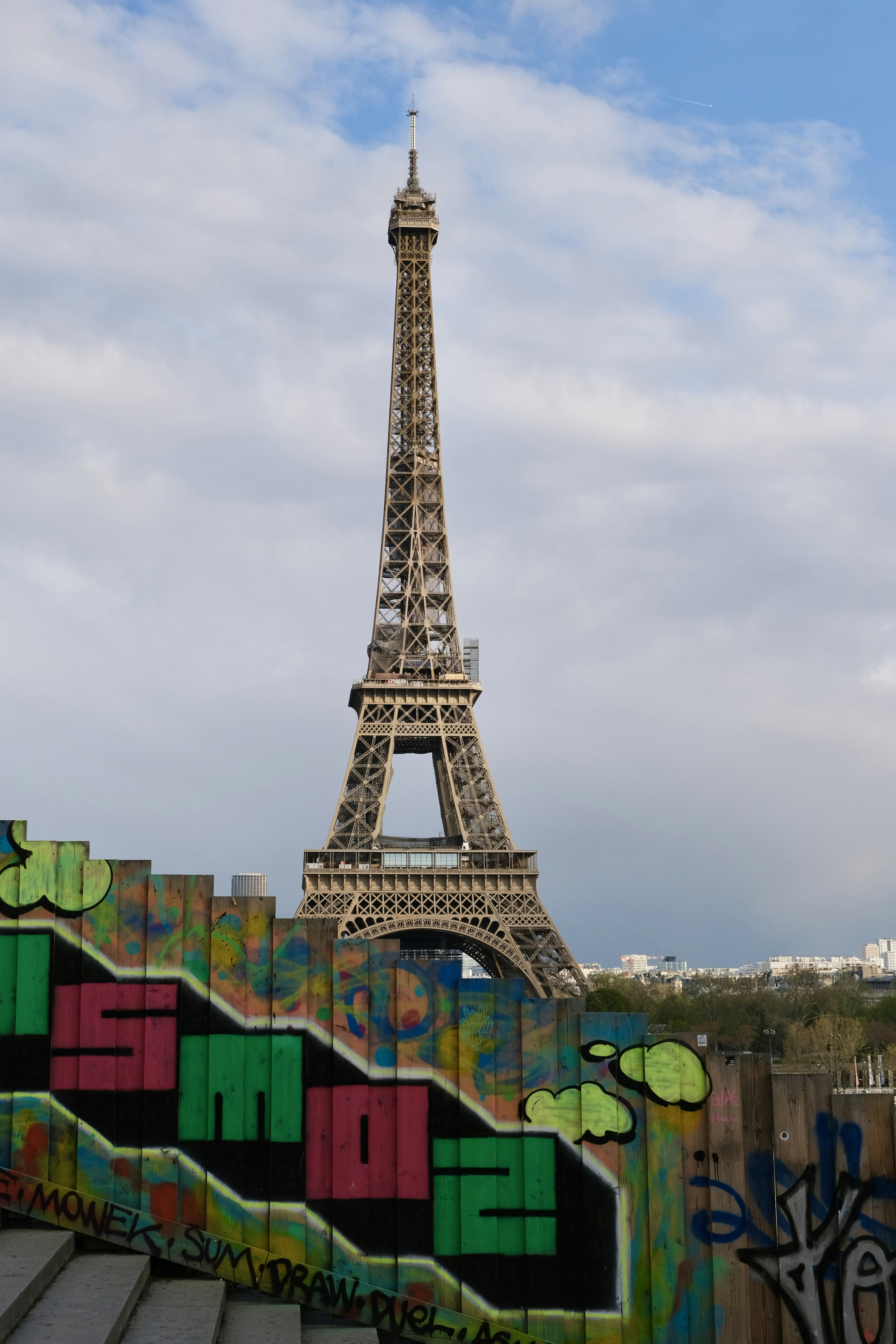 Eiffel Tower Rising Over a Graffiti-Colored Foreground