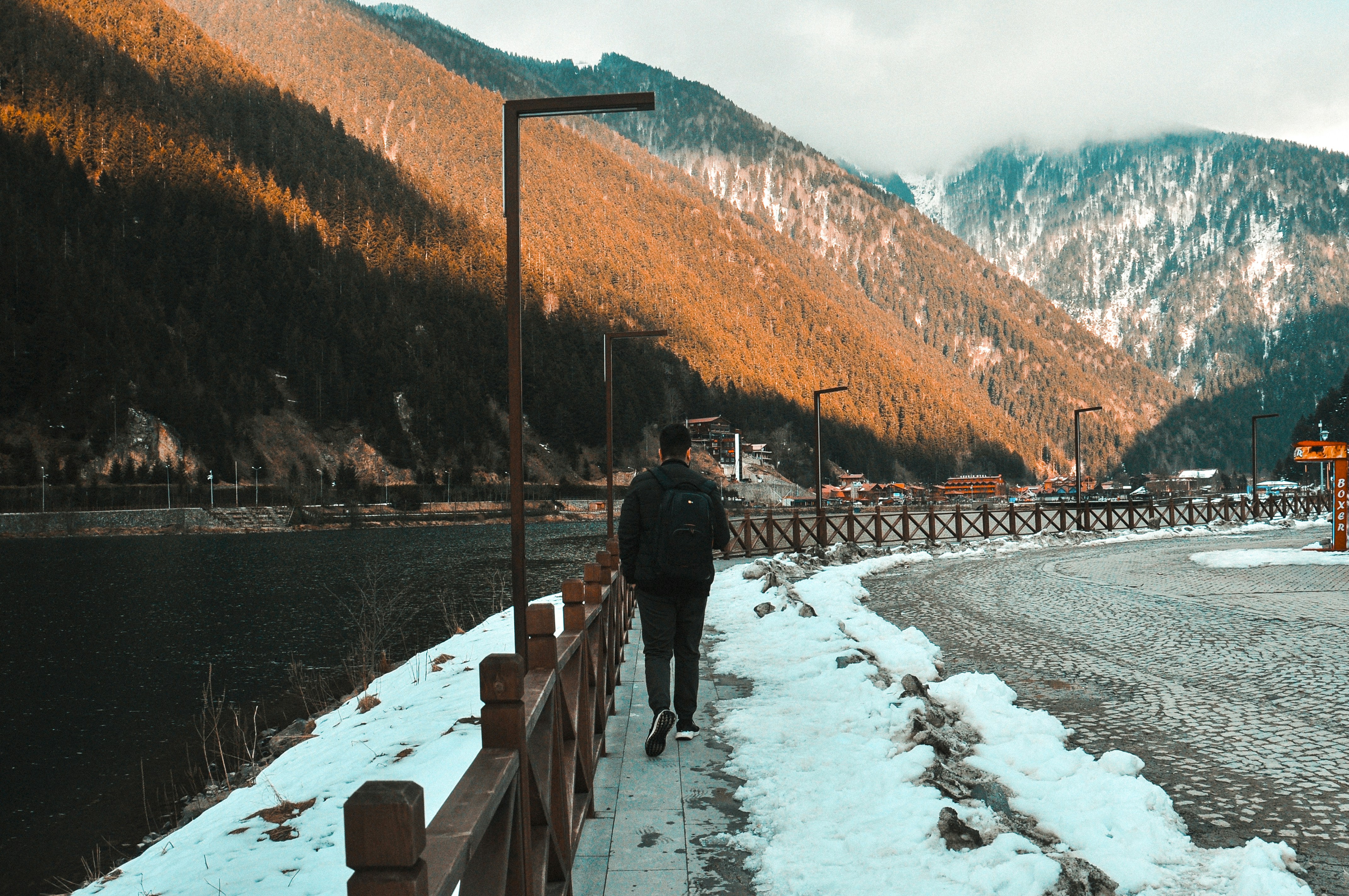 Quiet Lakeside Stroll Under Golden Mountain Slopes