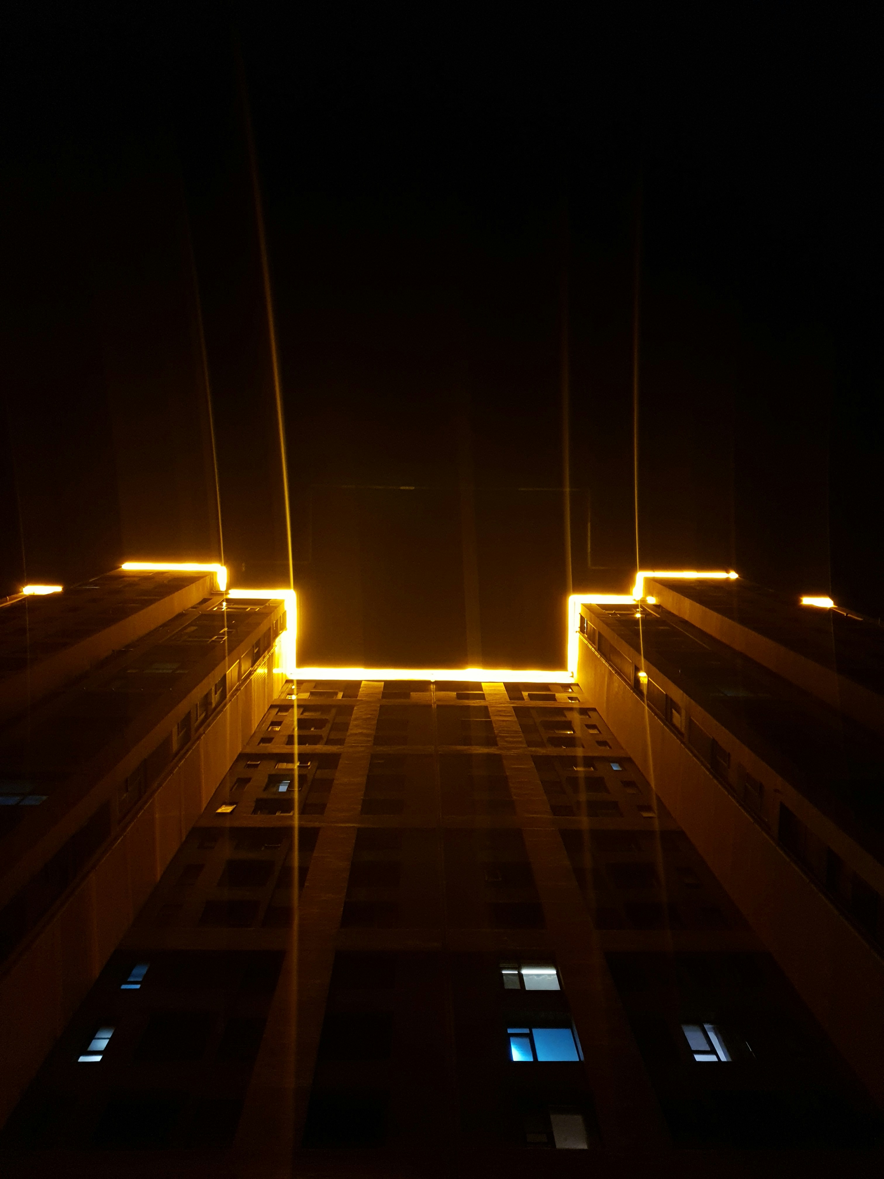 Neon Crown Between Towered Facades