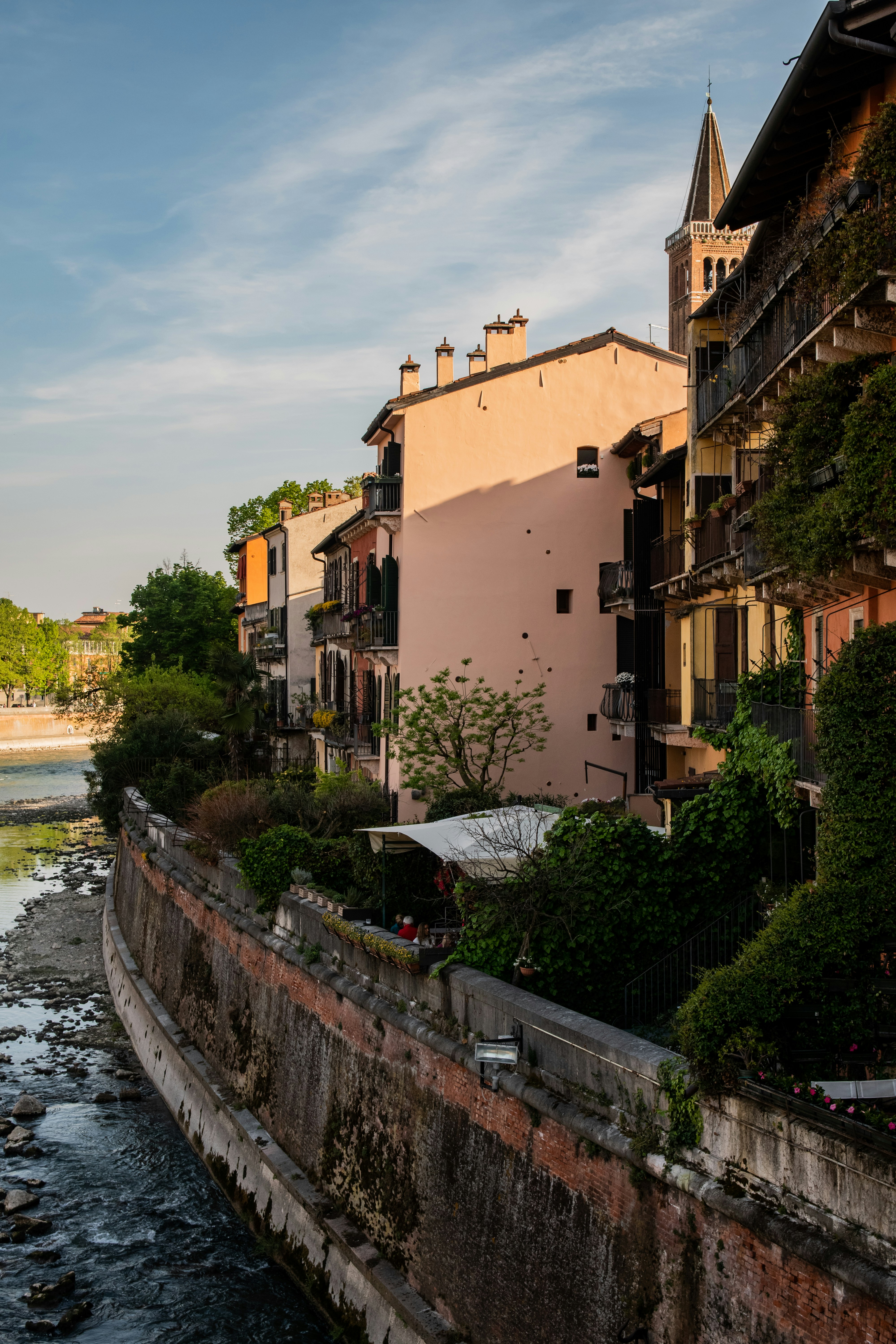 A river running through a city next to tall buildings photo – Free ...