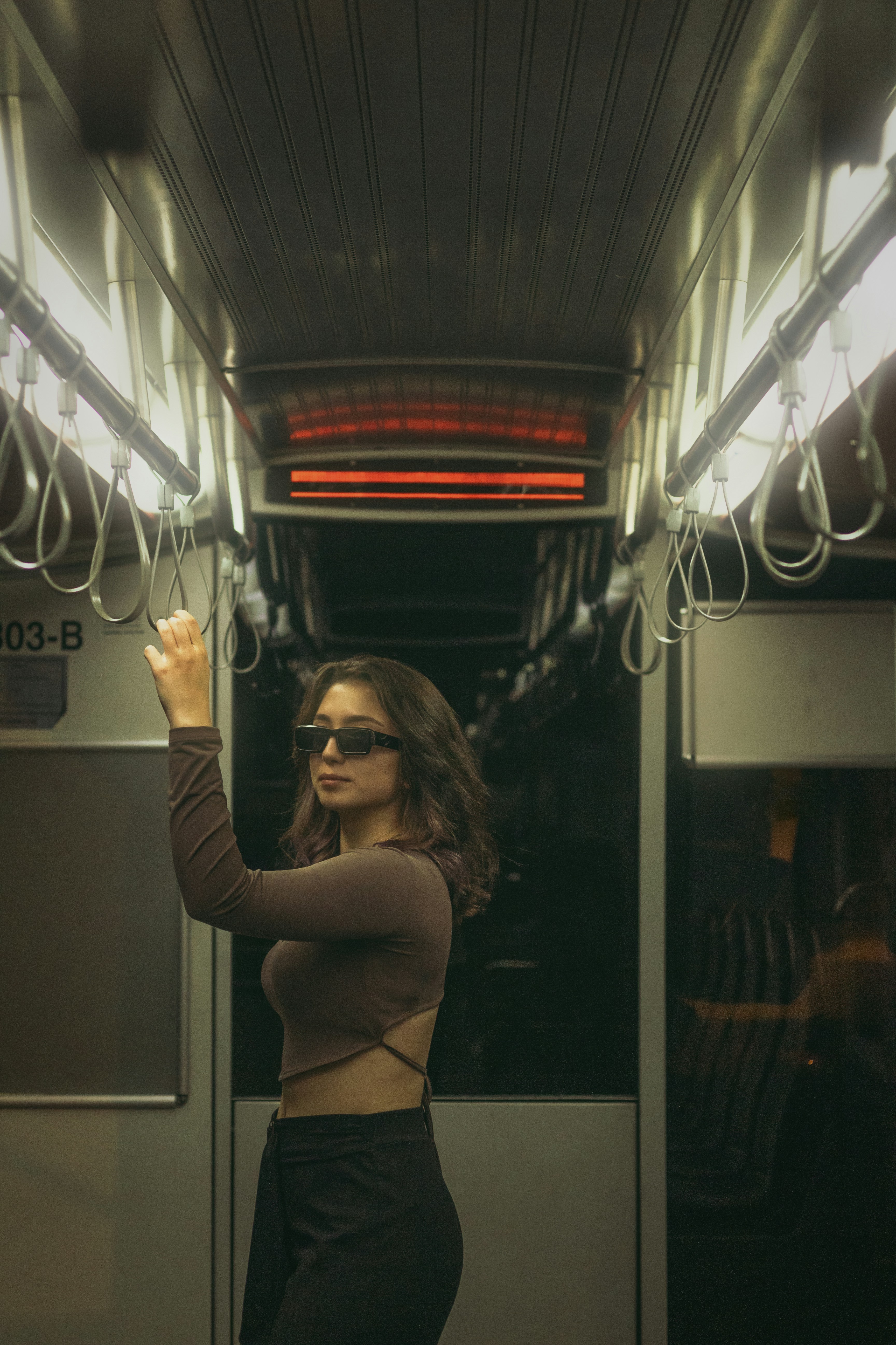 Neon Echo in the Subway: A Poised Moment