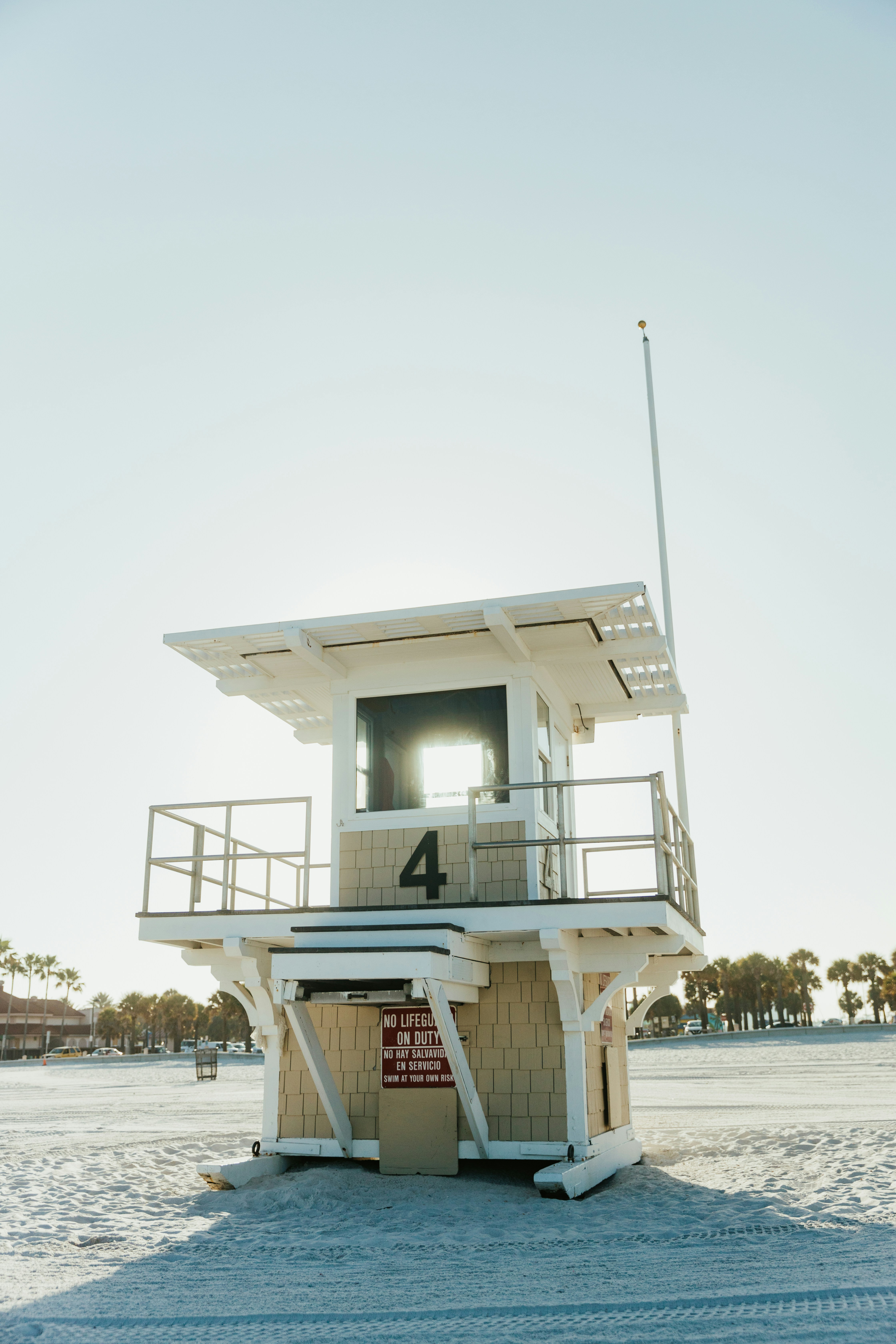 Backlit Sentinel: Lifeguard Tower 4 Over a Quiet Beach