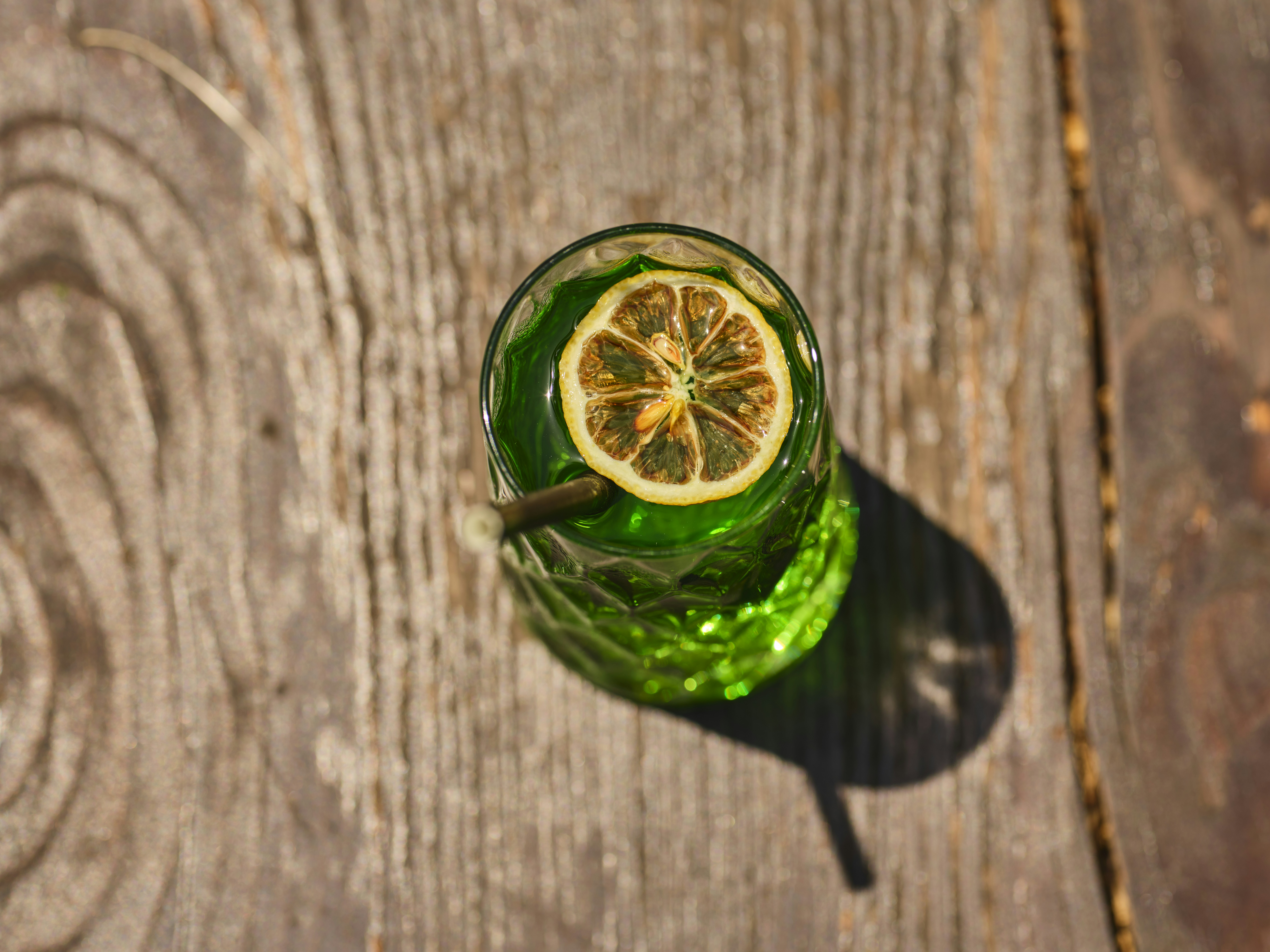 Lime Glow on Weathered Wood: A Quiet Drink Portrait