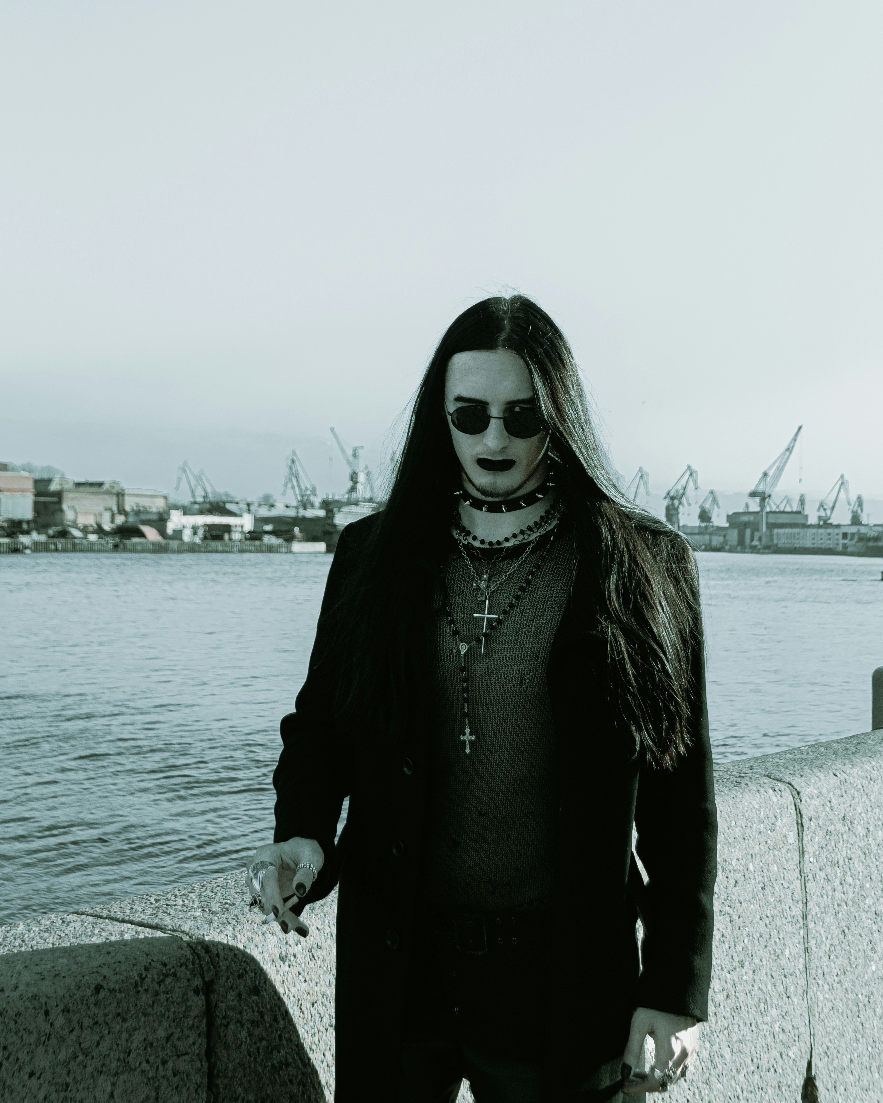 Harbor Noir: Gothic Portrait Beneath Industrial Skies