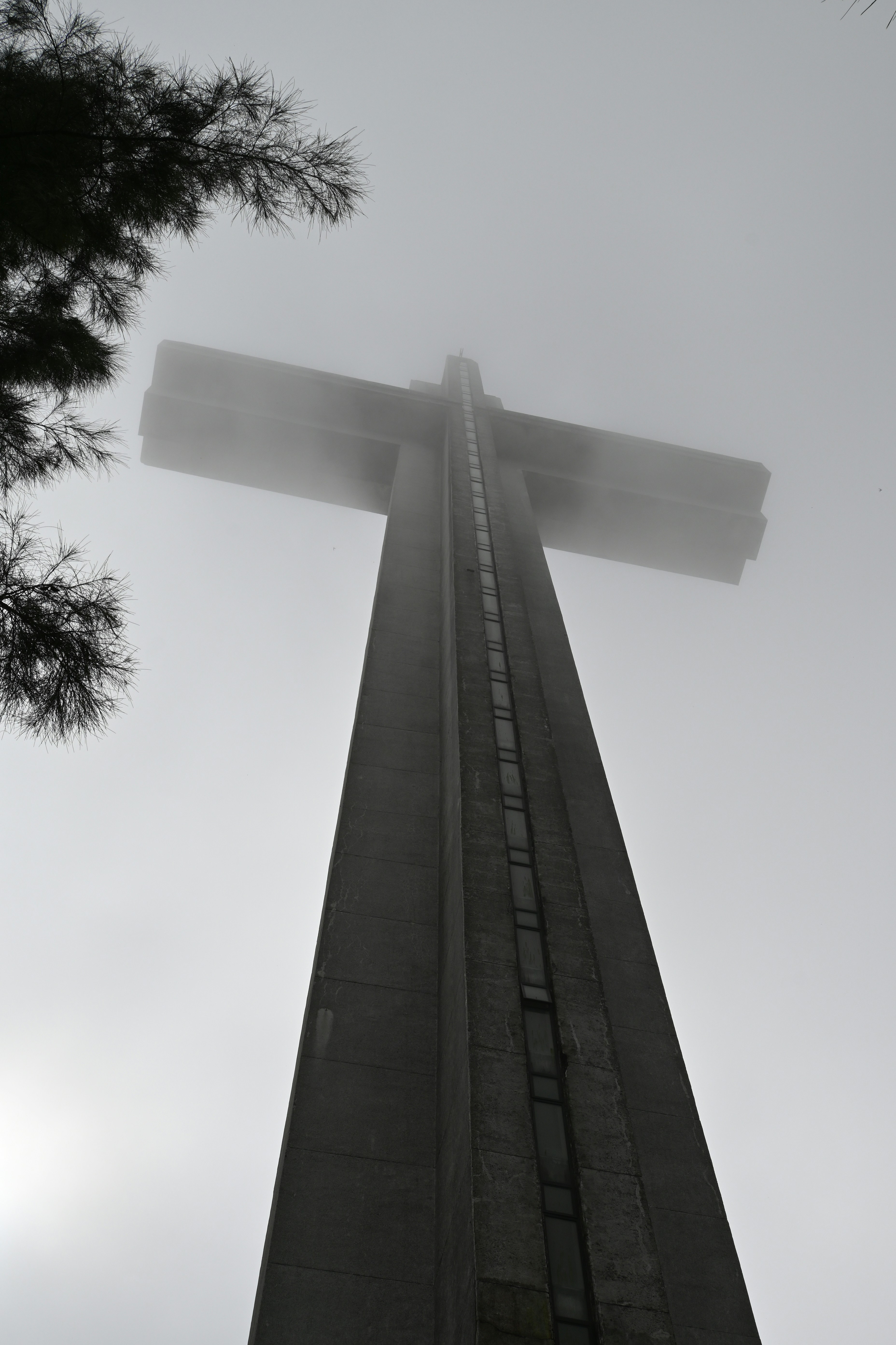 A tall tower with a cross on top of it photo – Free Grey Image on Unsplash