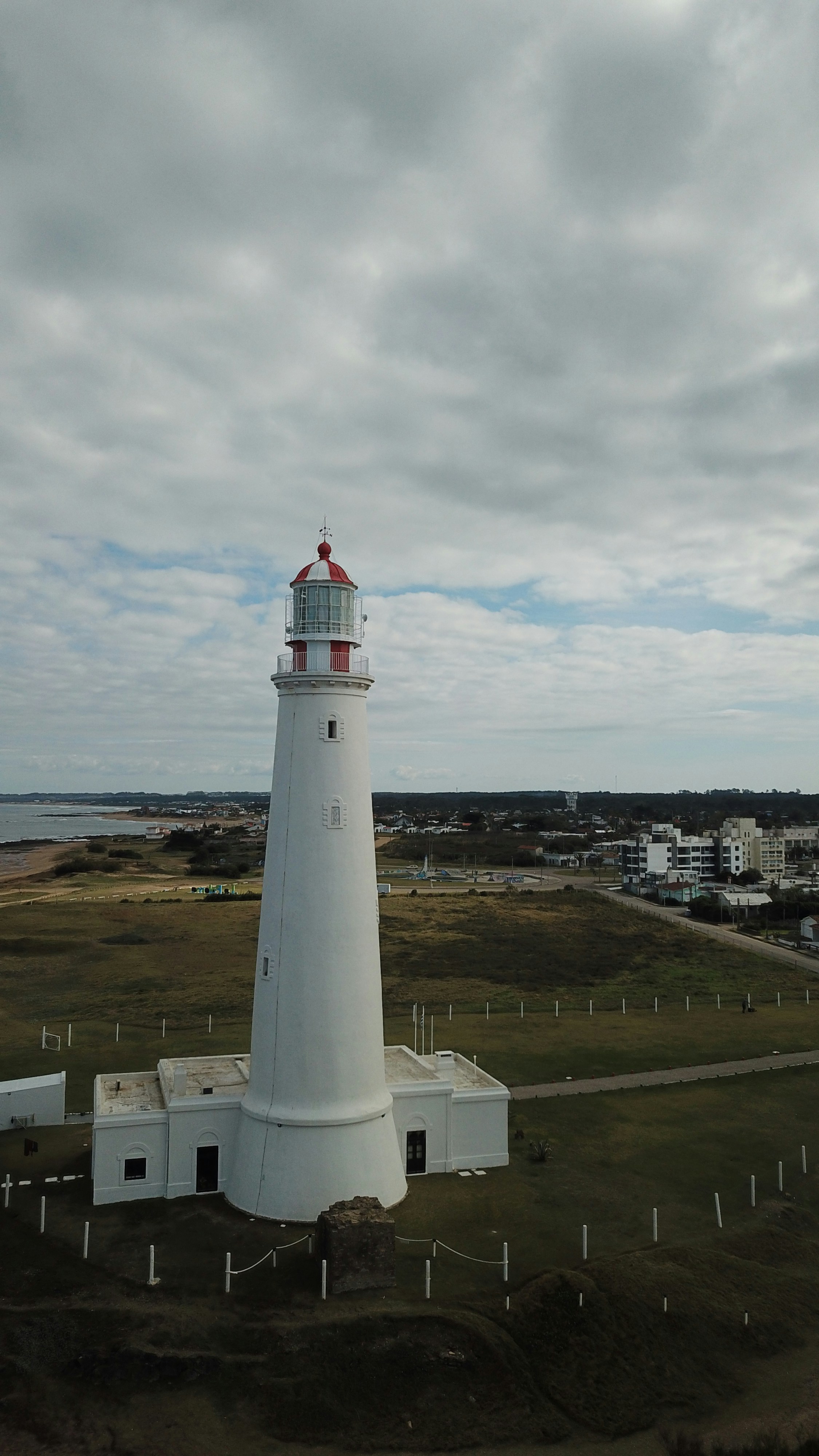 White Lighthouse Standing Guard Over a Quiet Coastal Plain