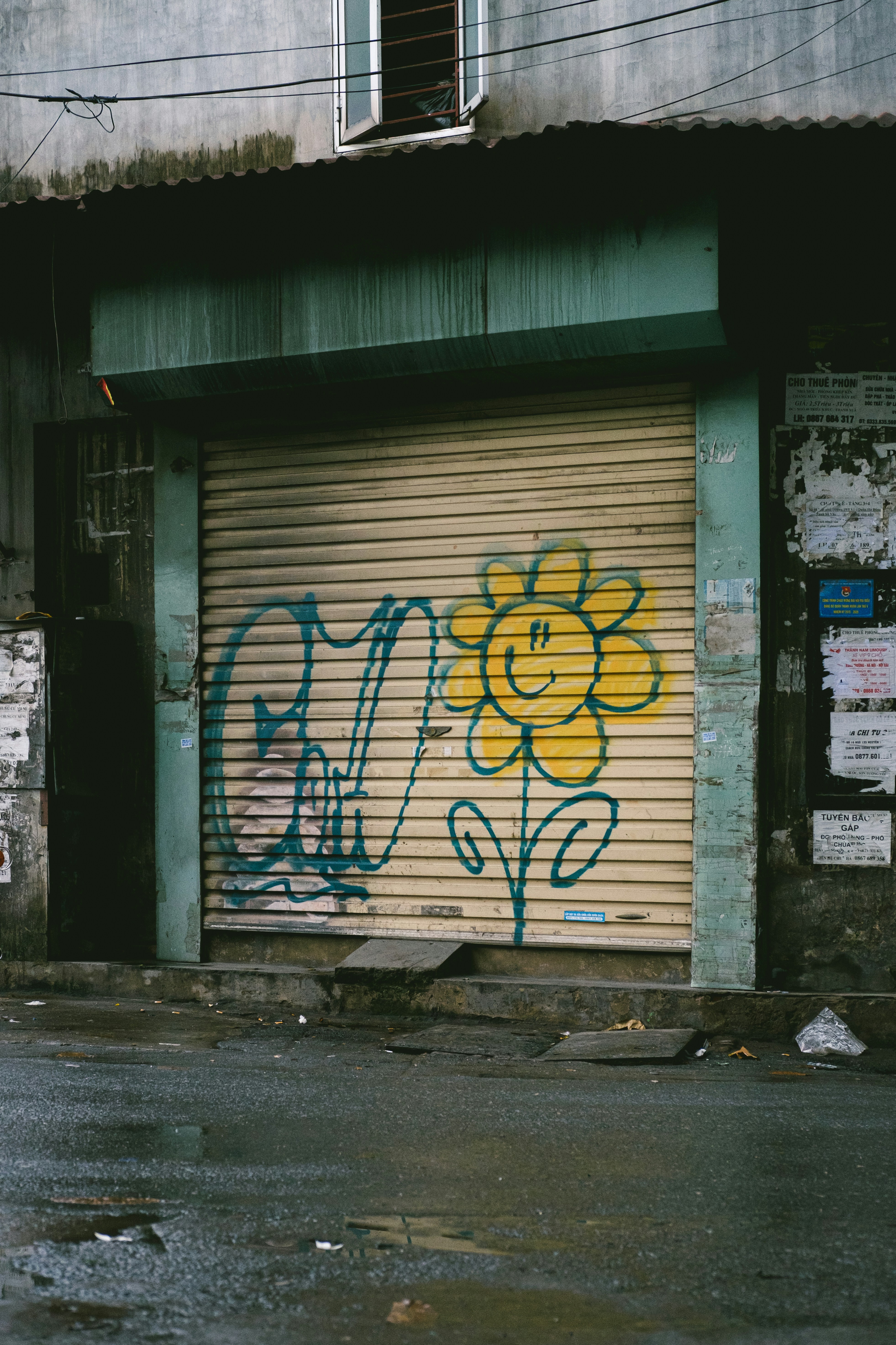 a garage door with graffiti on the side of it