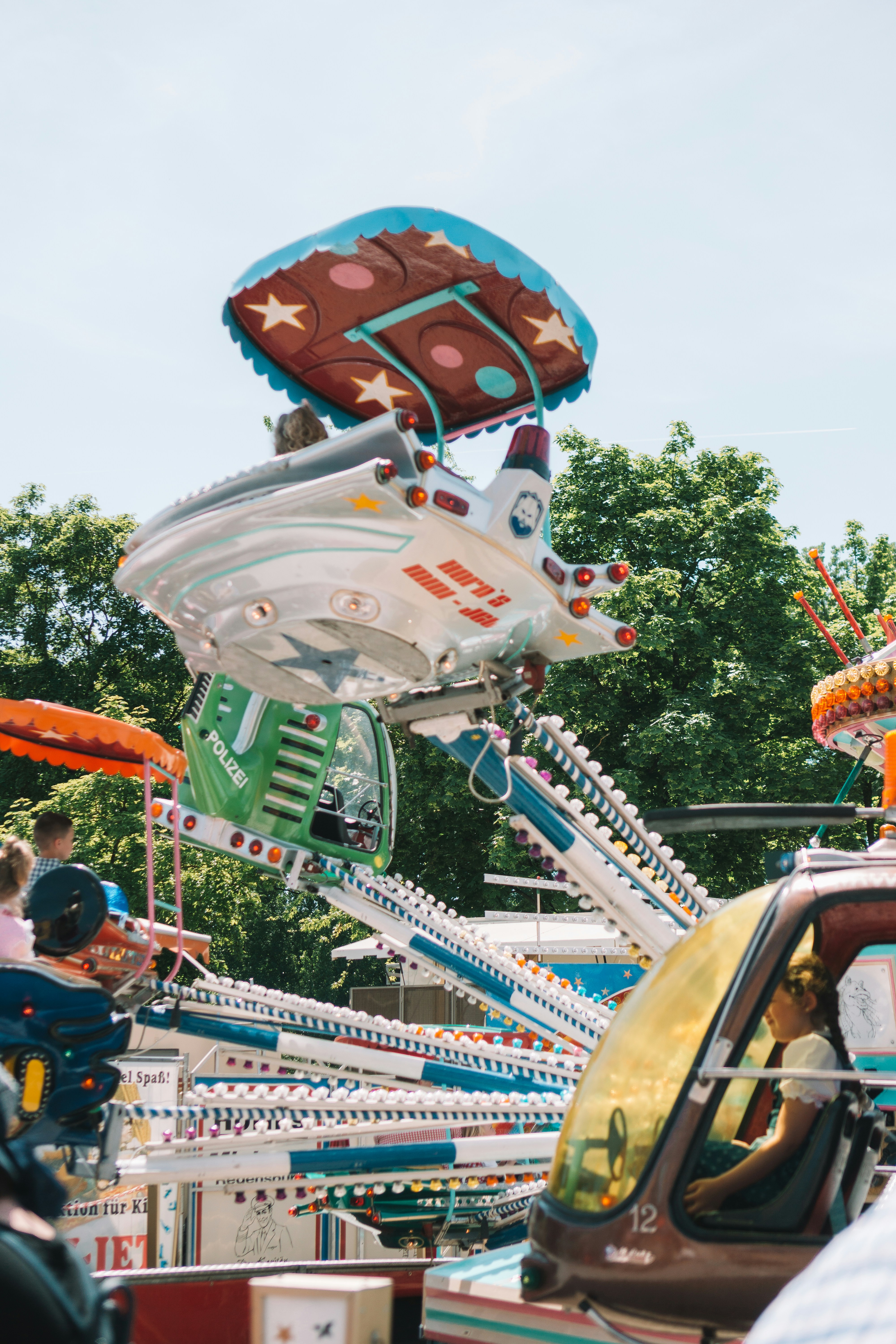 A carnival ride with people riding on it photo – Free Human Image on ...