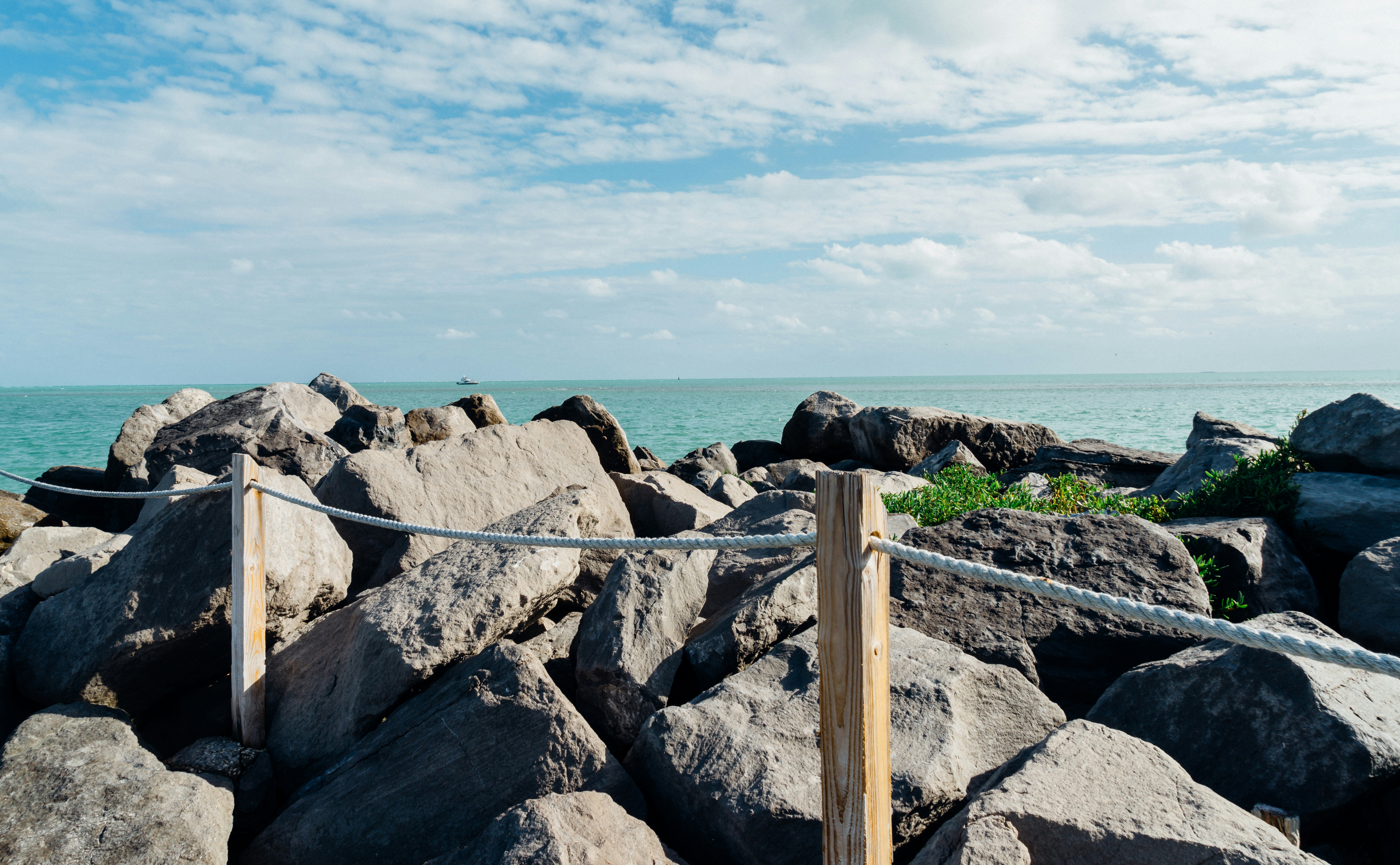 Rope-Railed Refuge: A Rocky Path to the Open Sea