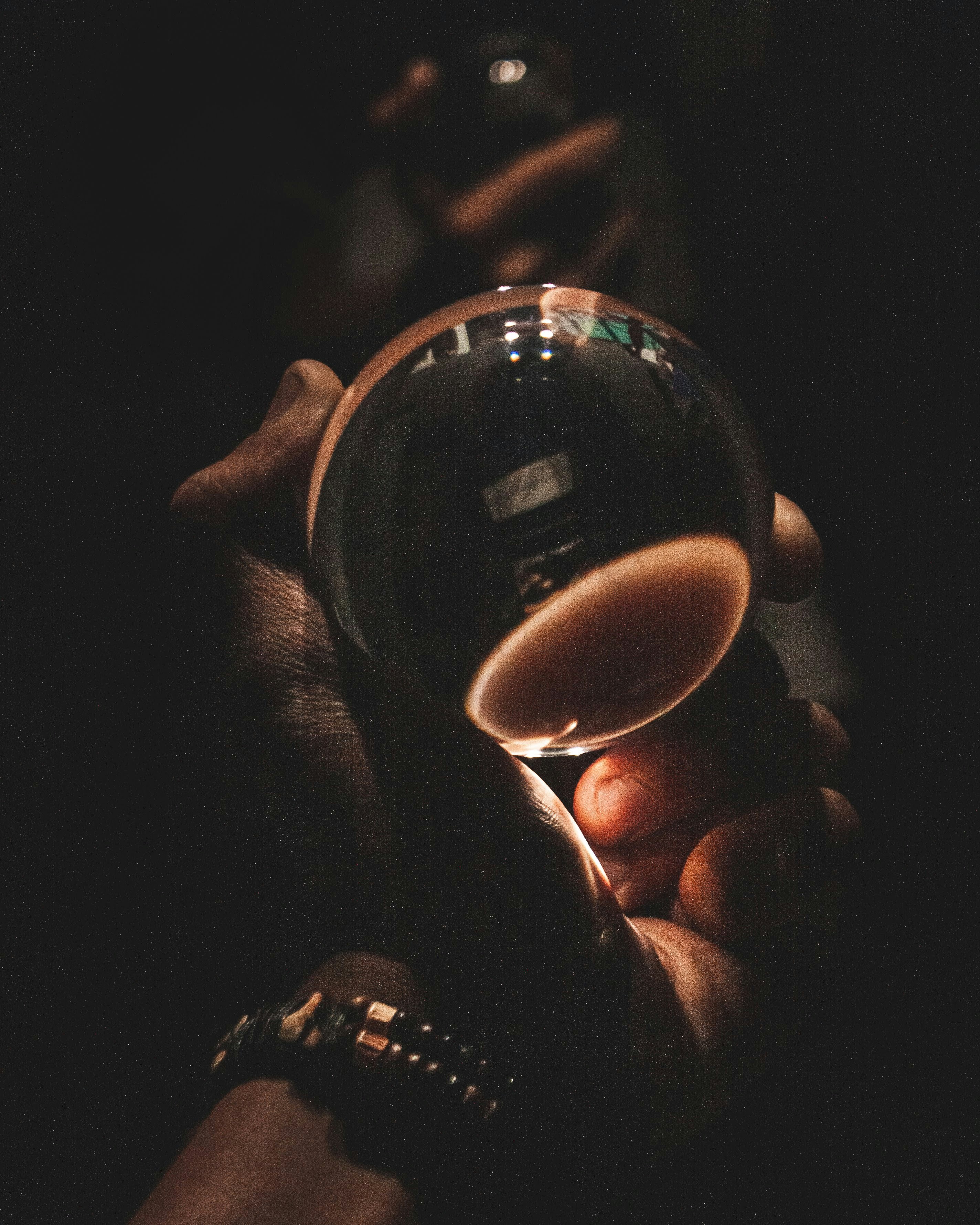 a person holding a wine glass in their hand