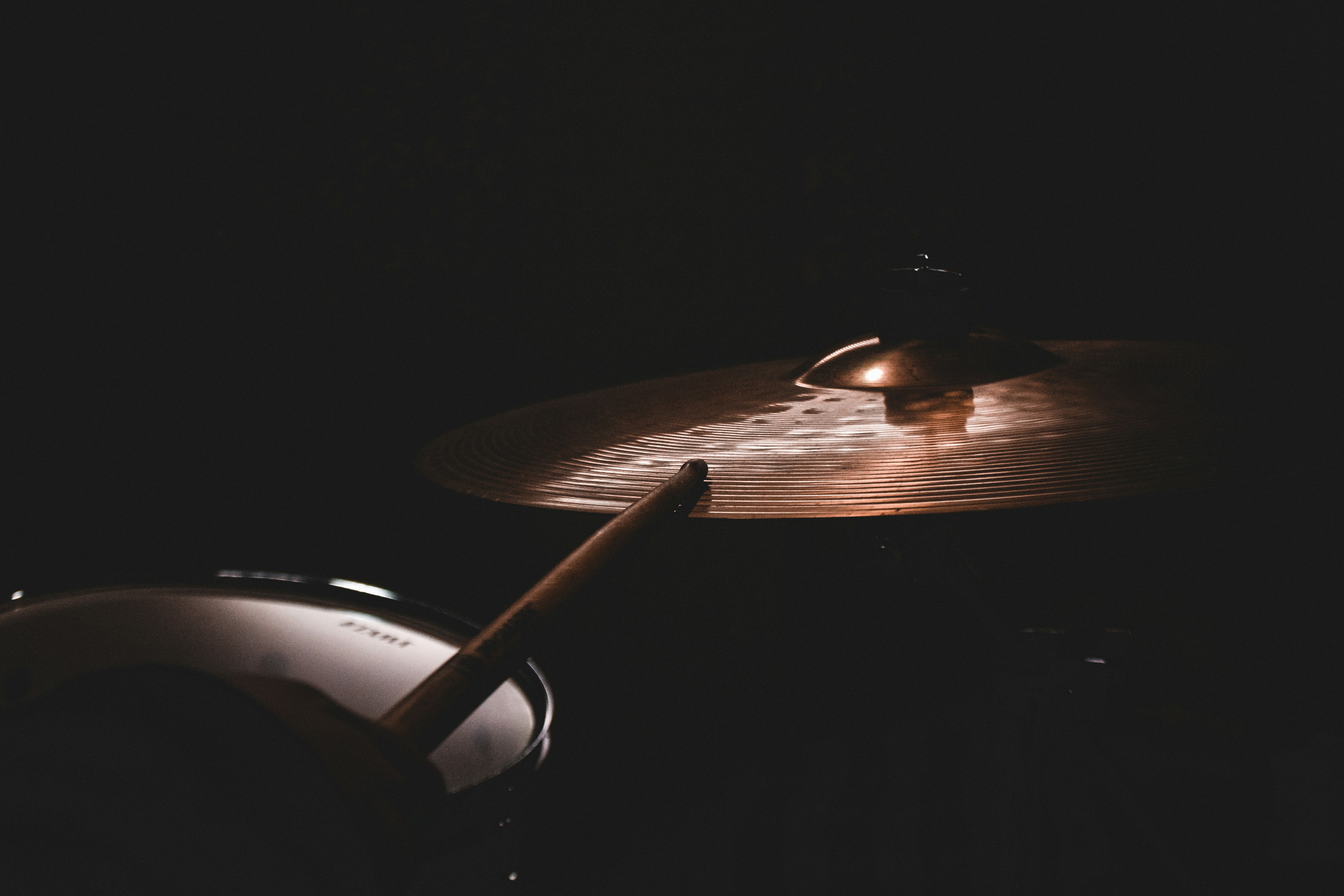 a close up of a drum set in the dark