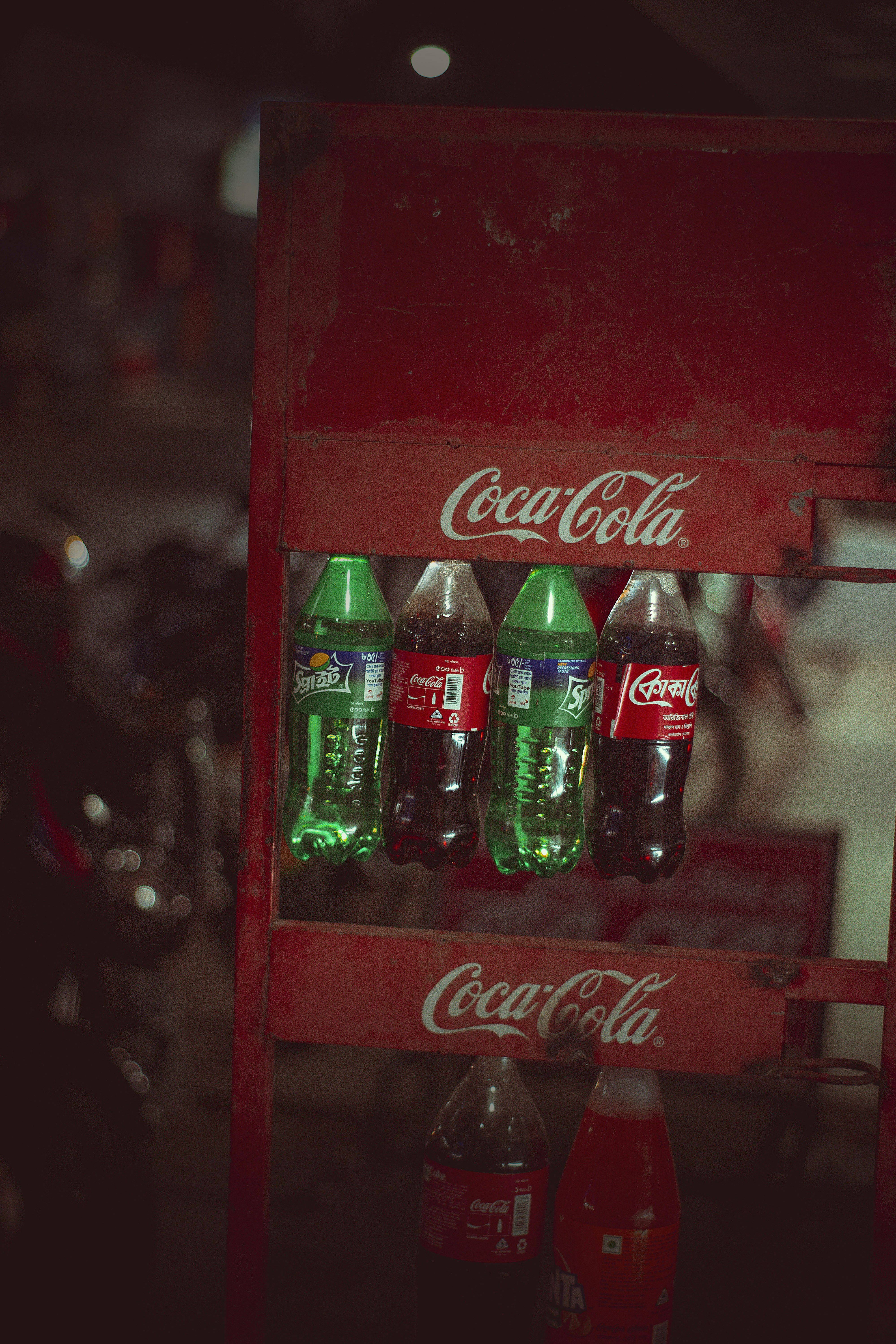 Red Frame, Green Bottles: A Dim Night Coke Stand