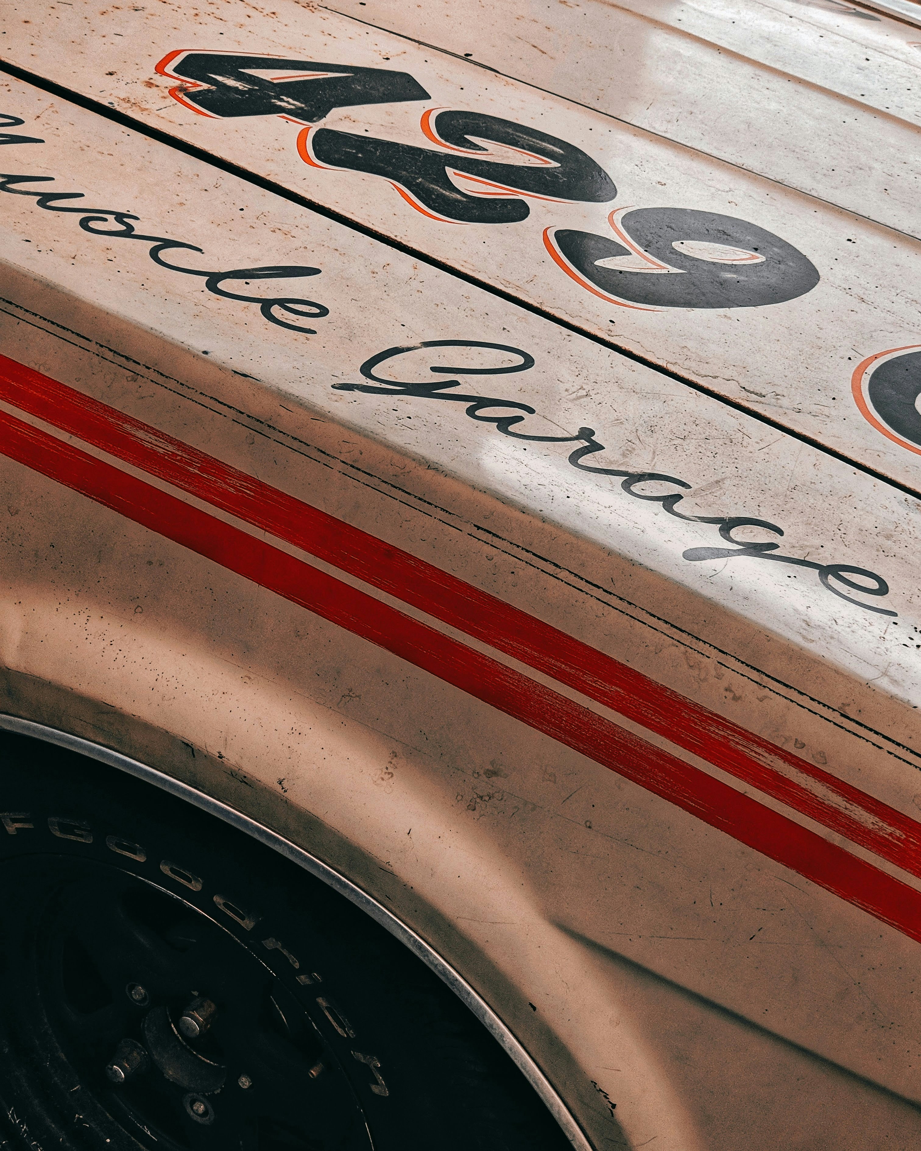 A close up of the side of a car with numbers painted on it photo – Free ...