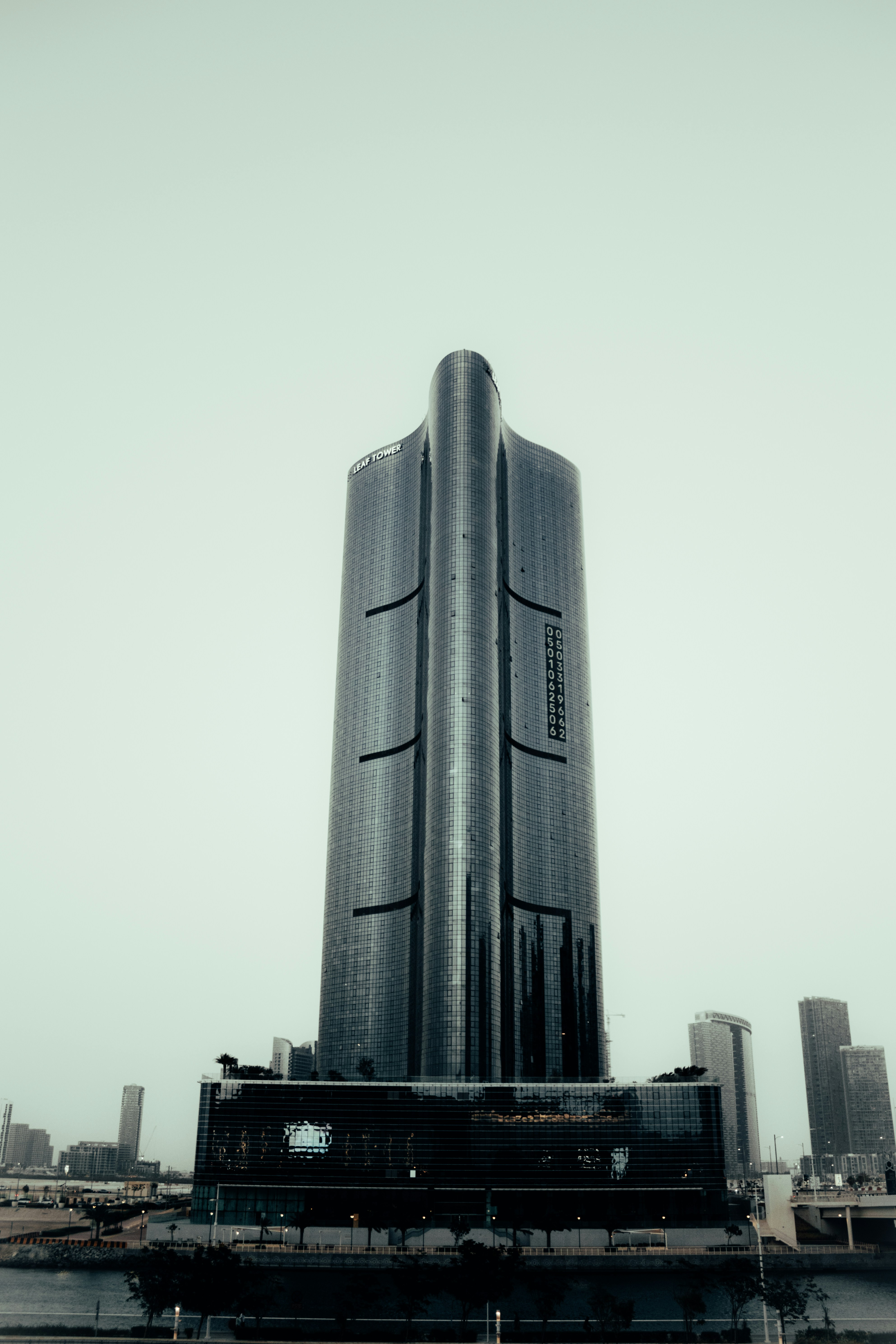 a very tall building in the middle of a city