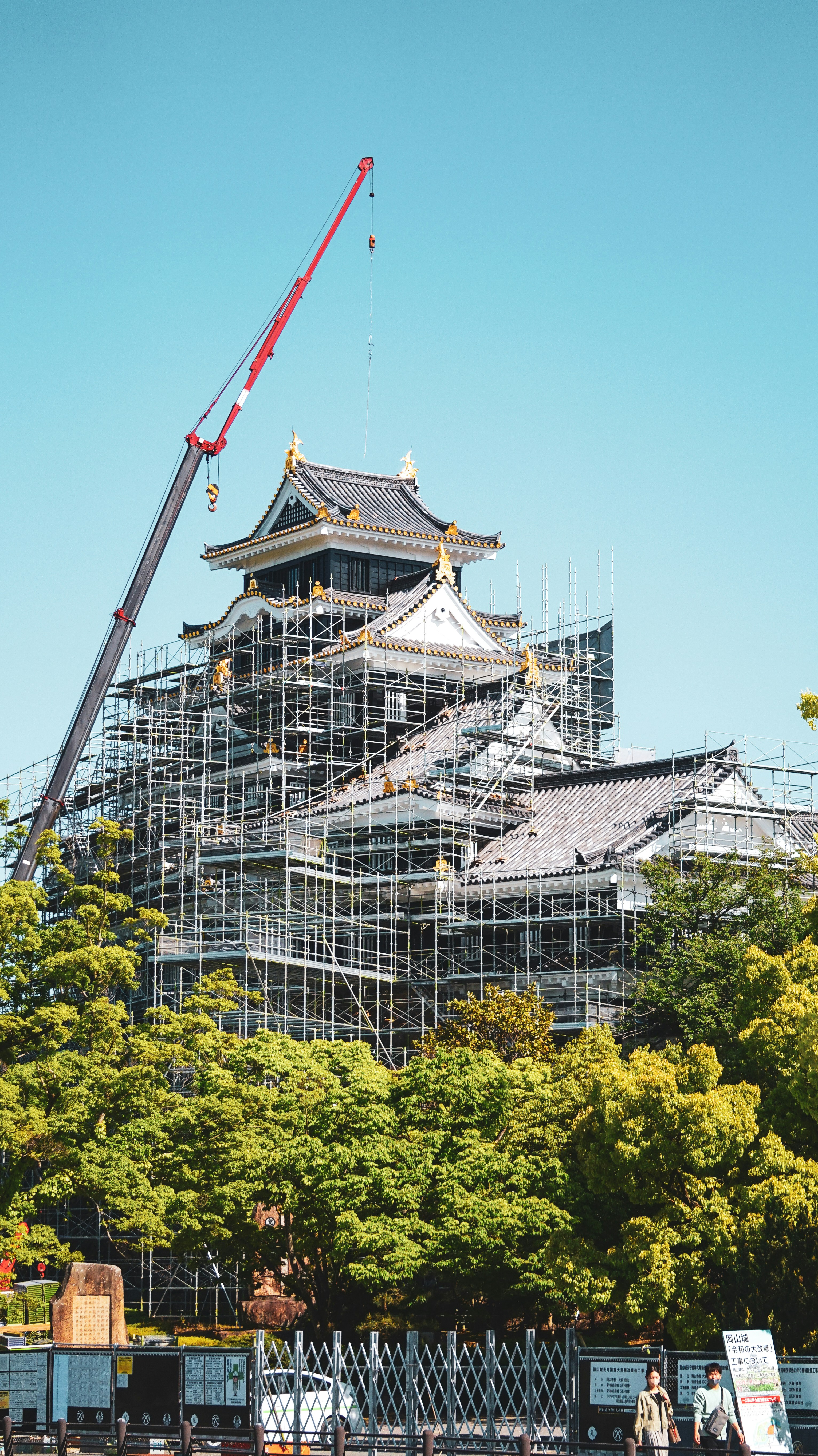 a crane is on top of a building under construction