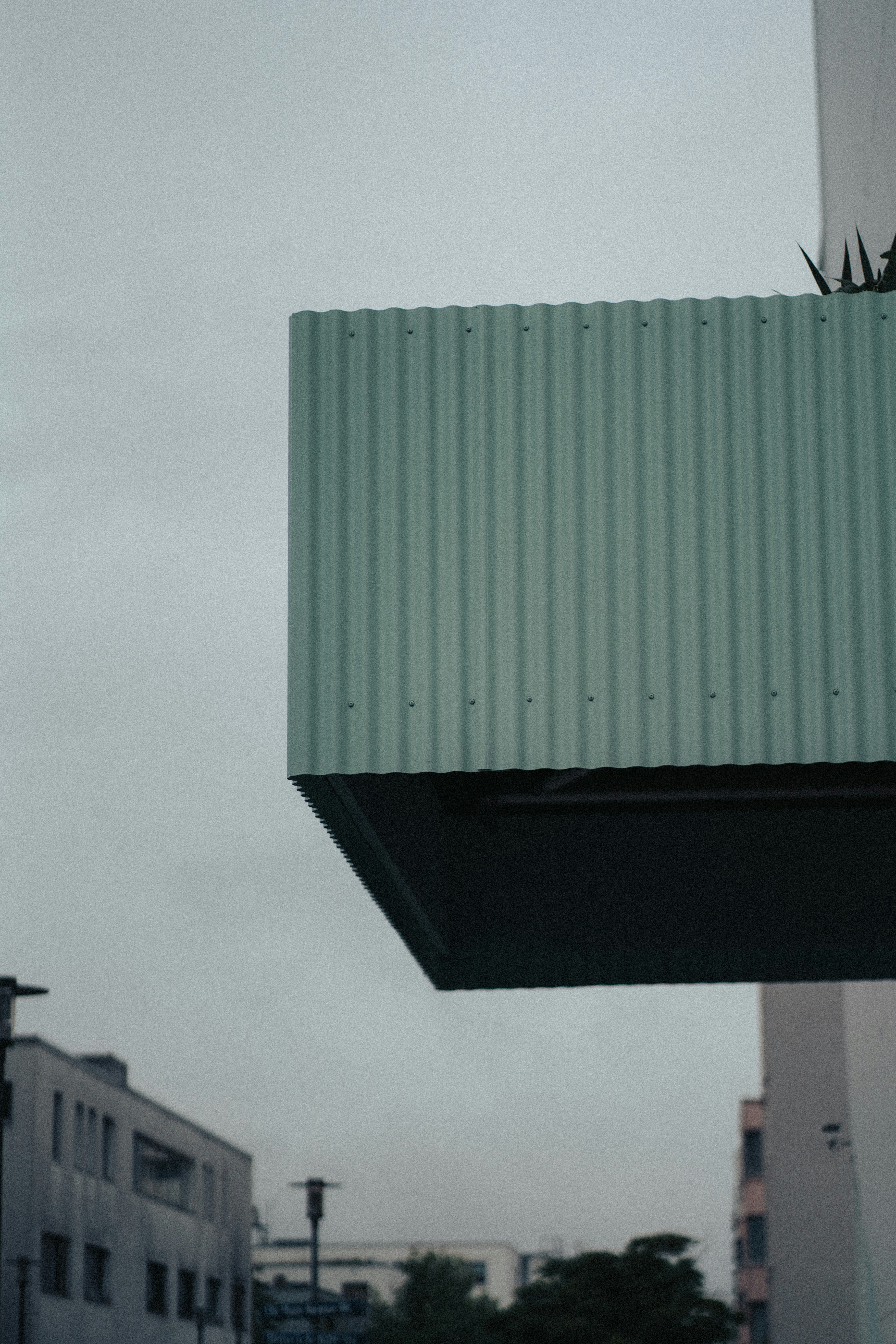 Mint Corrugation: The Quiet Geometry of a City Overhang