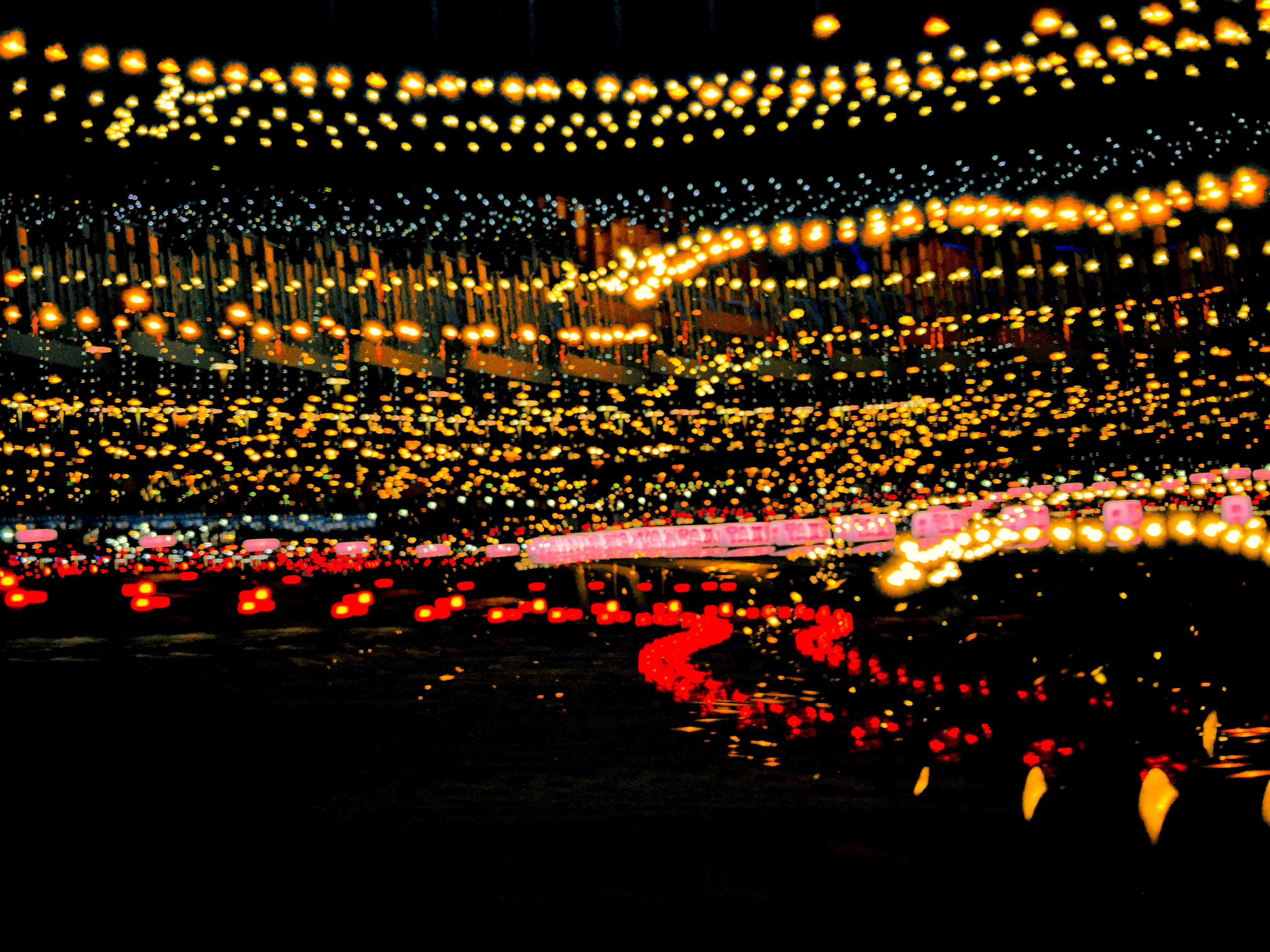 a night scene with a lot of lights hanging from the ceiling