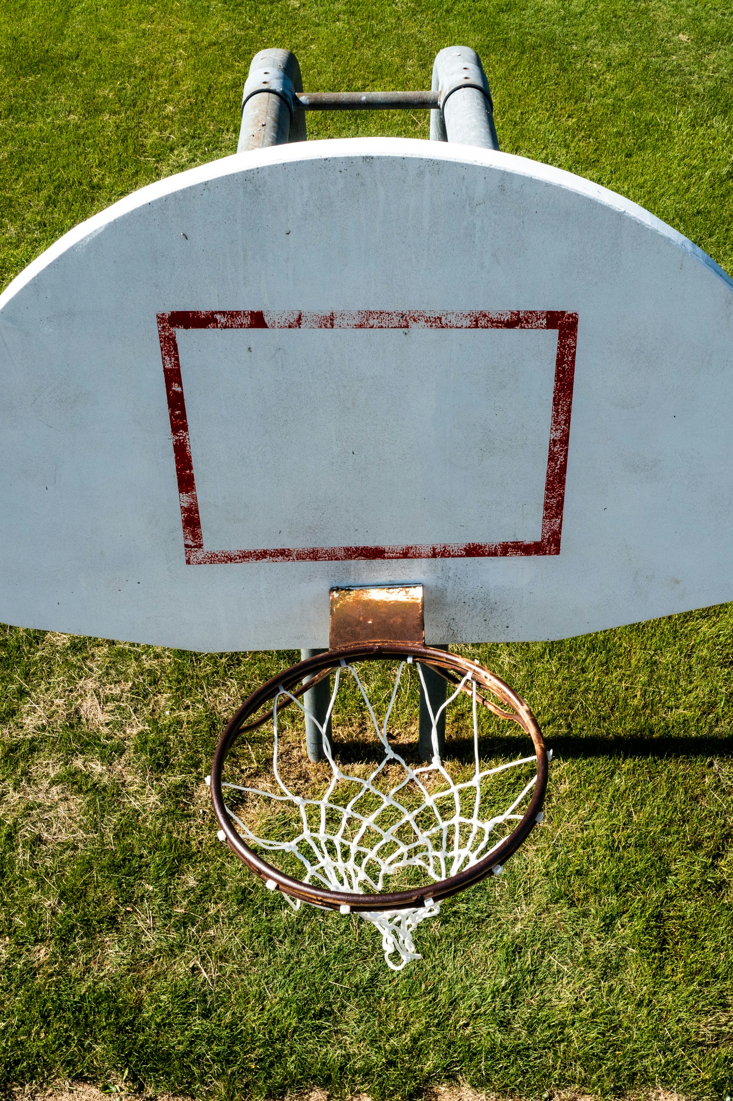 An overhead view of a basketball hoop in the grass photo – Free Grey ...