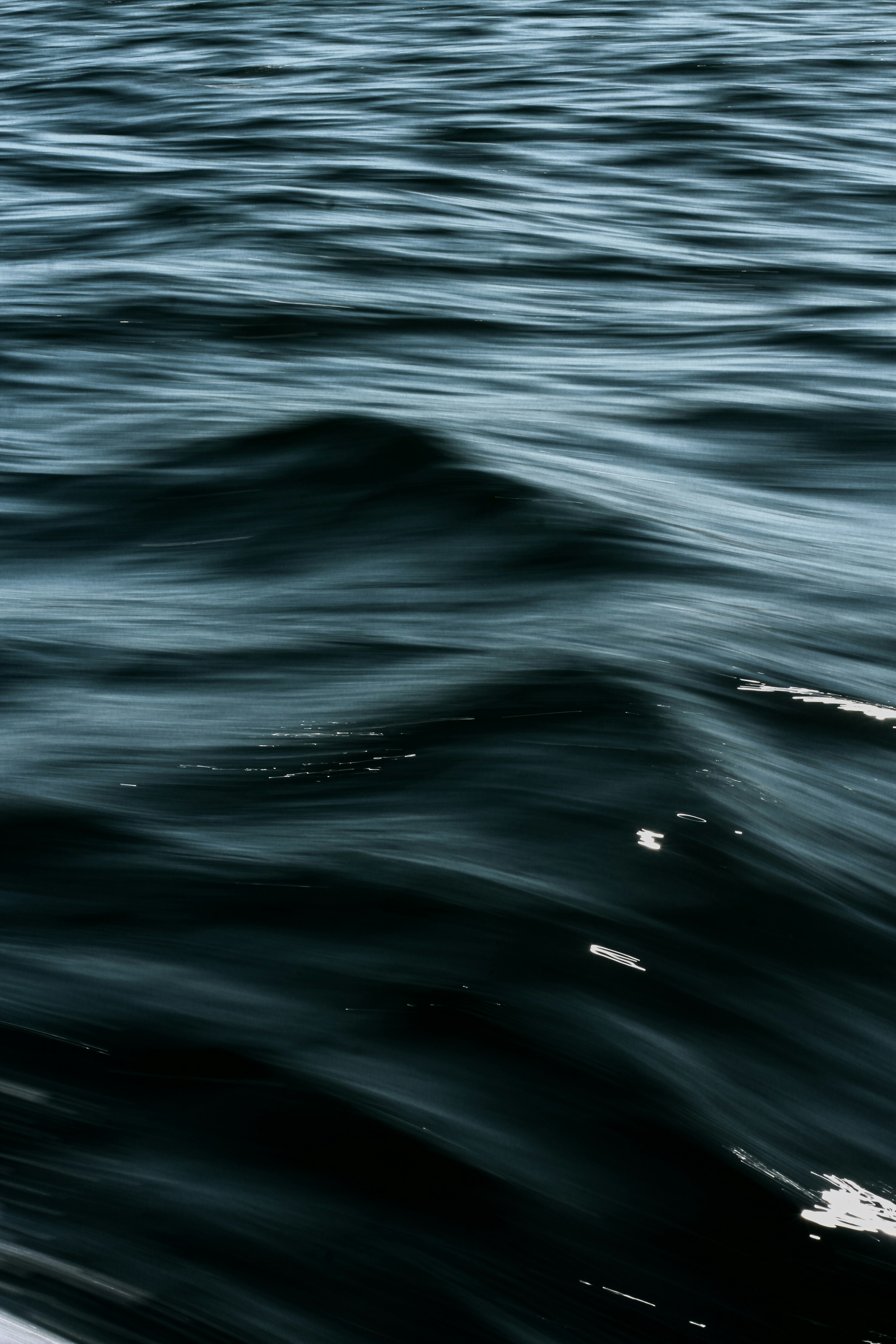 Indigo Ripples in Motion: A Long-Exposure Sea