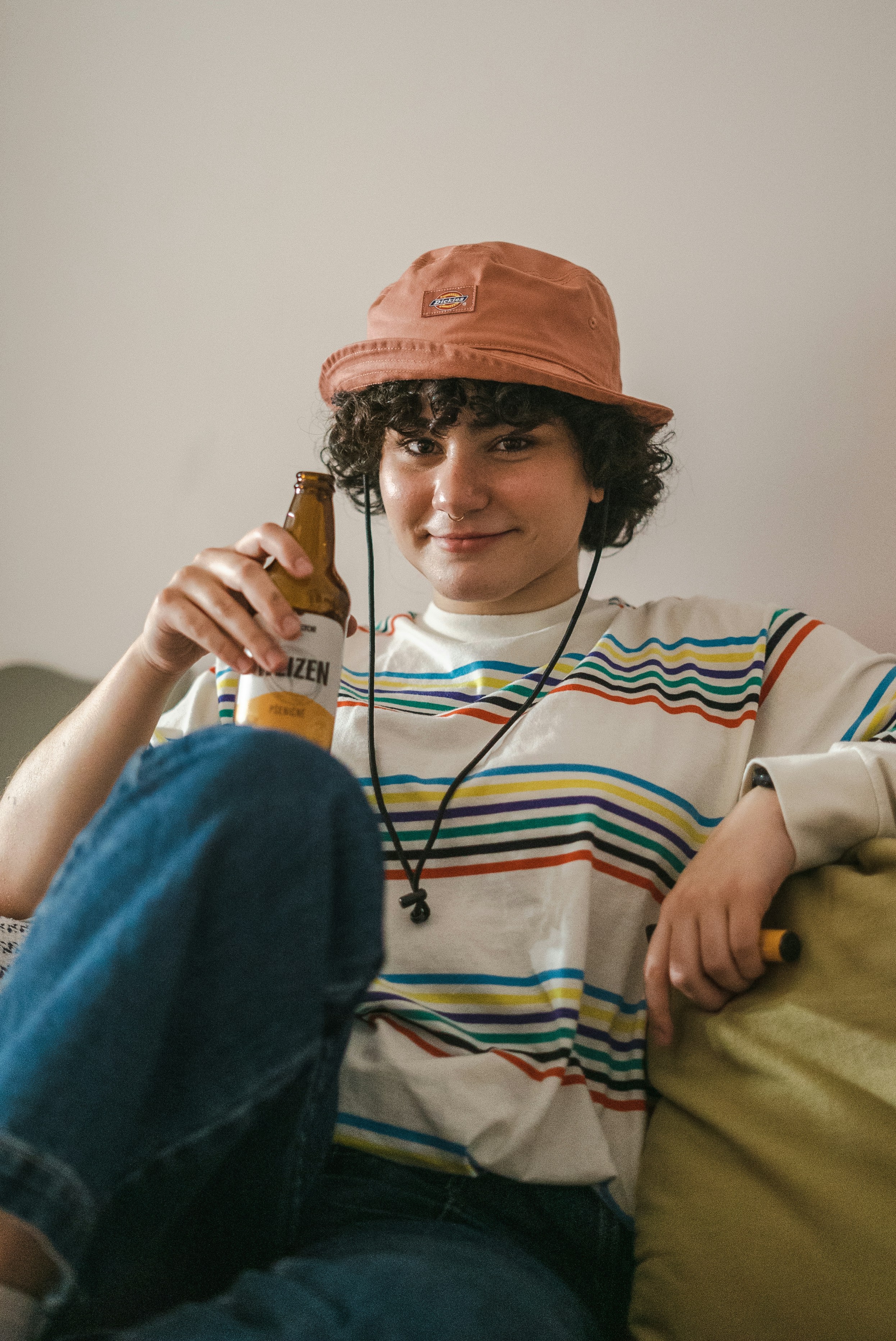 Orange Hat, Striped Tee, and a Quiet Beer Moment