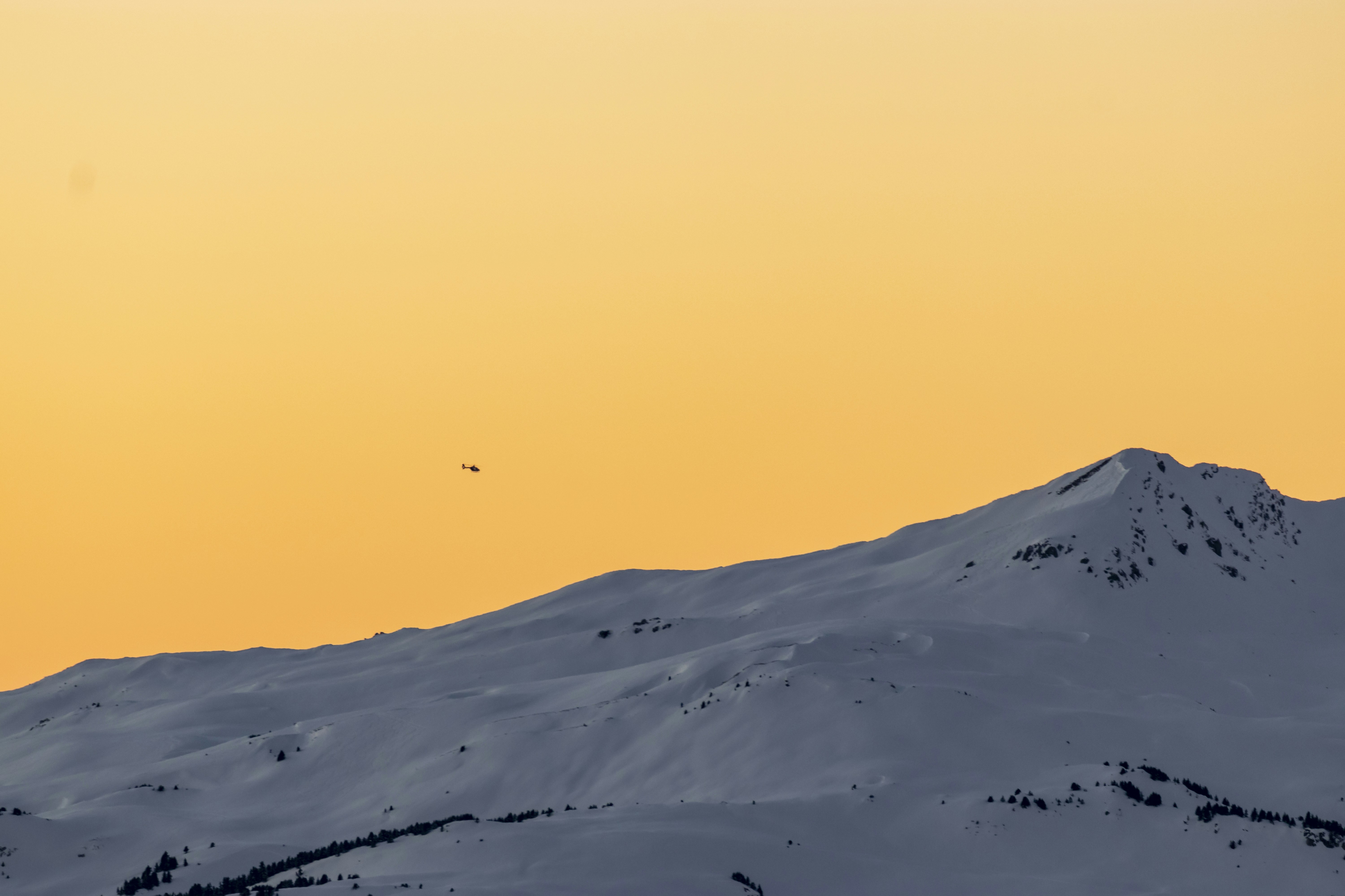 Dawn Glide Over a Snowbound Ridge