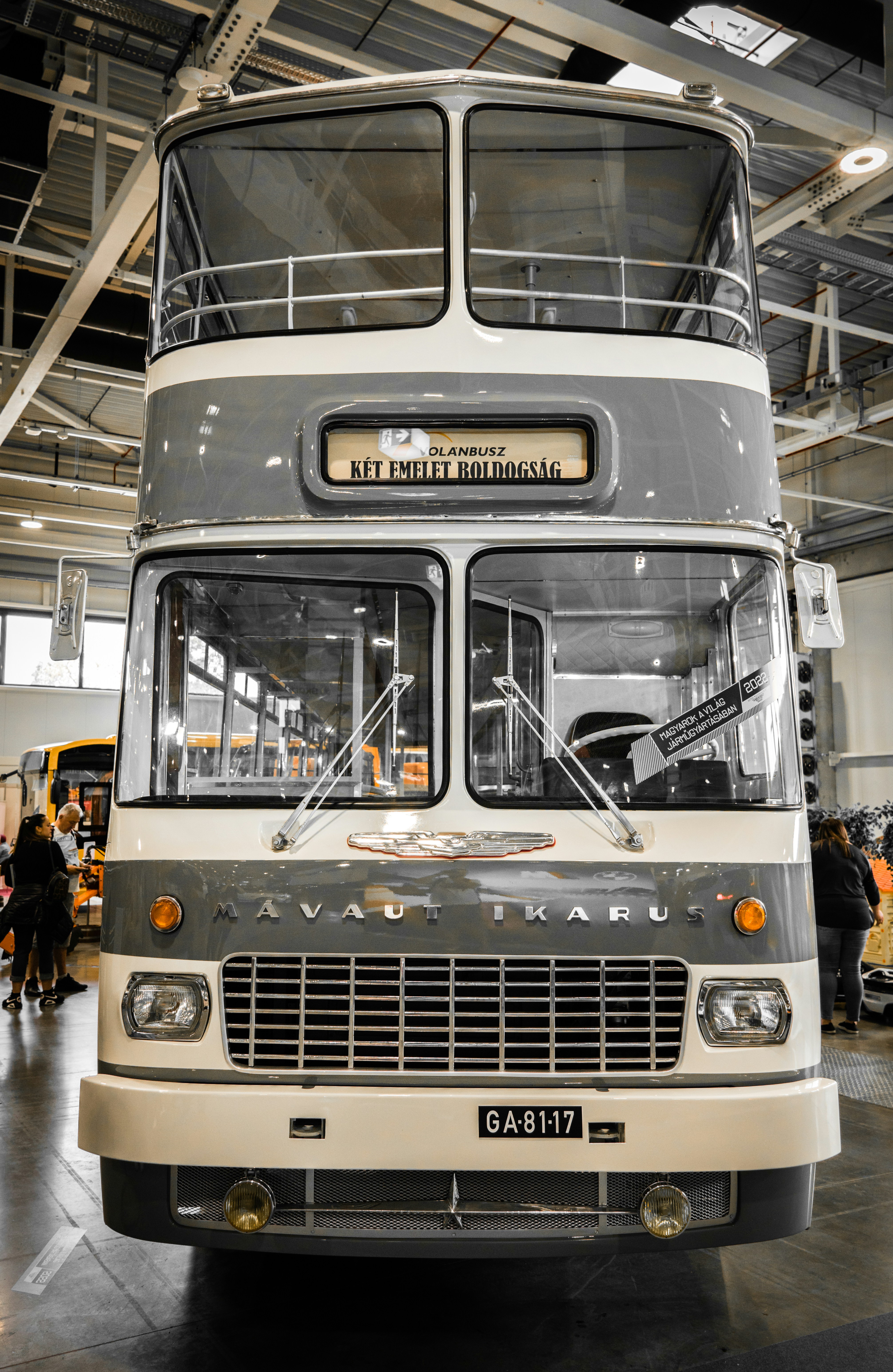 a double decker bus parked inside of a building