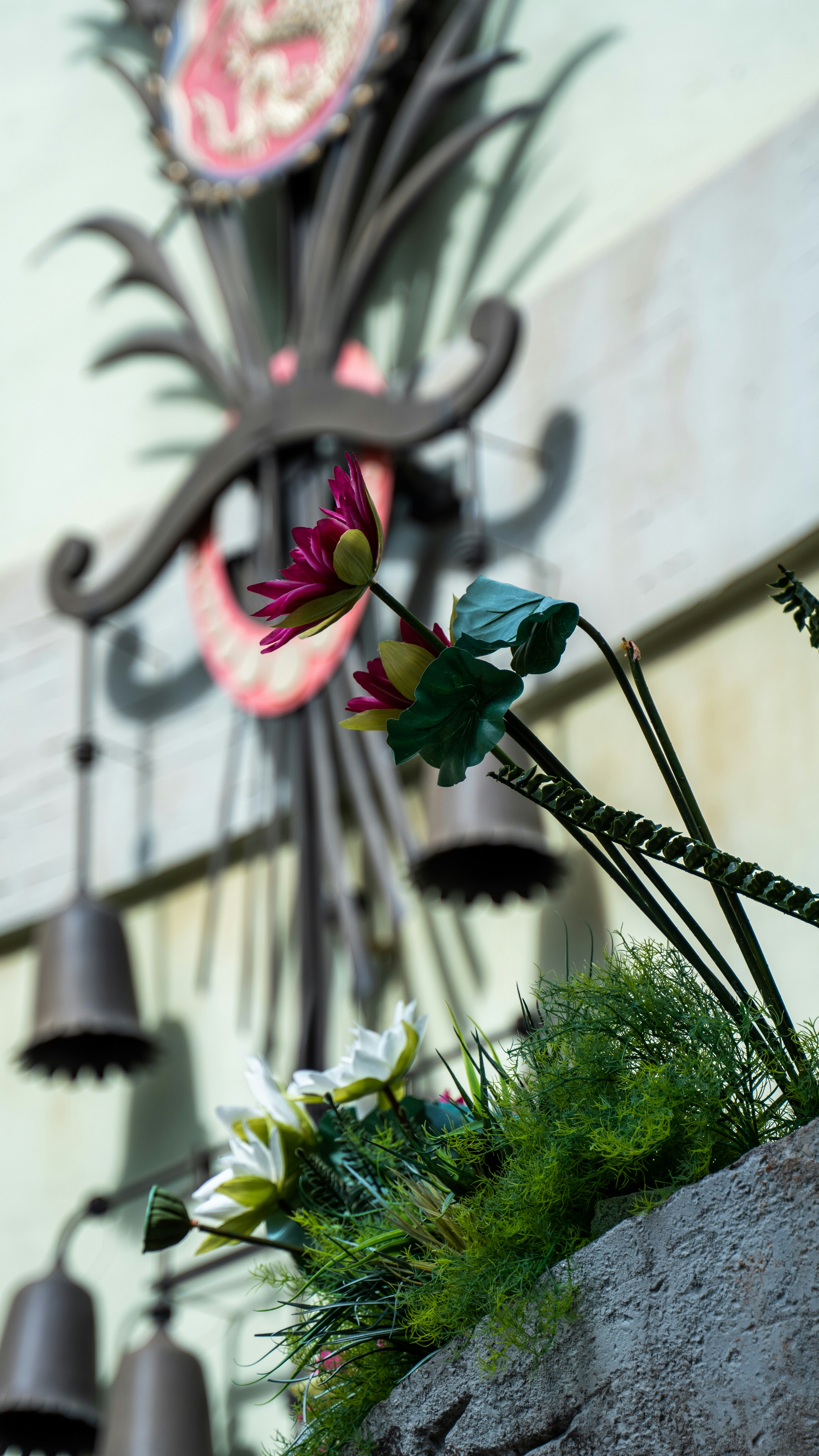 Desaturated Neon: Floral Accent by a Distant Sign