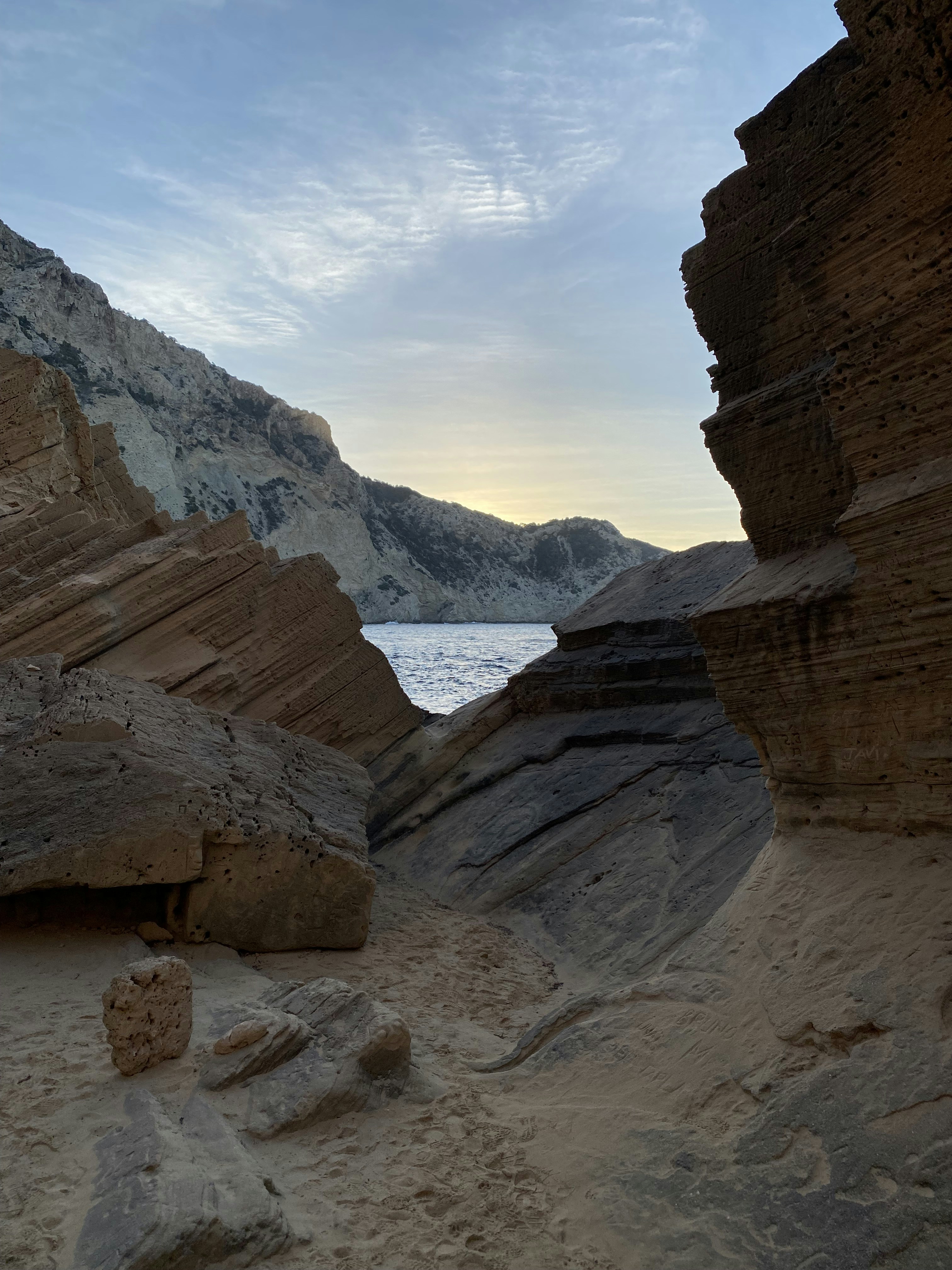 Sunset Through Stone Ribs: A Quiet Passage to the Sea