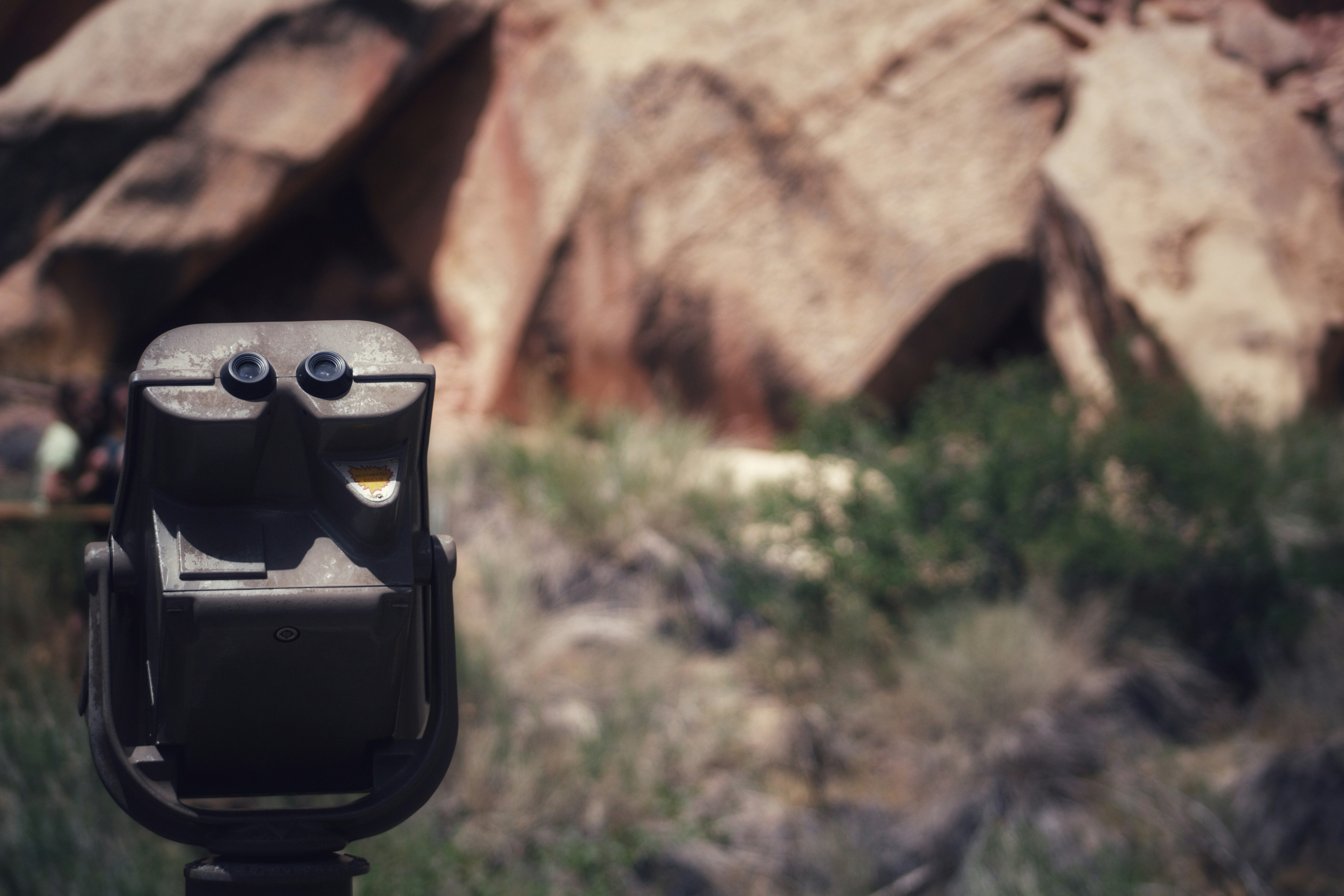 Overlook Eye: Desert Binocular Gazes Across Weathered Red Rock Gorge