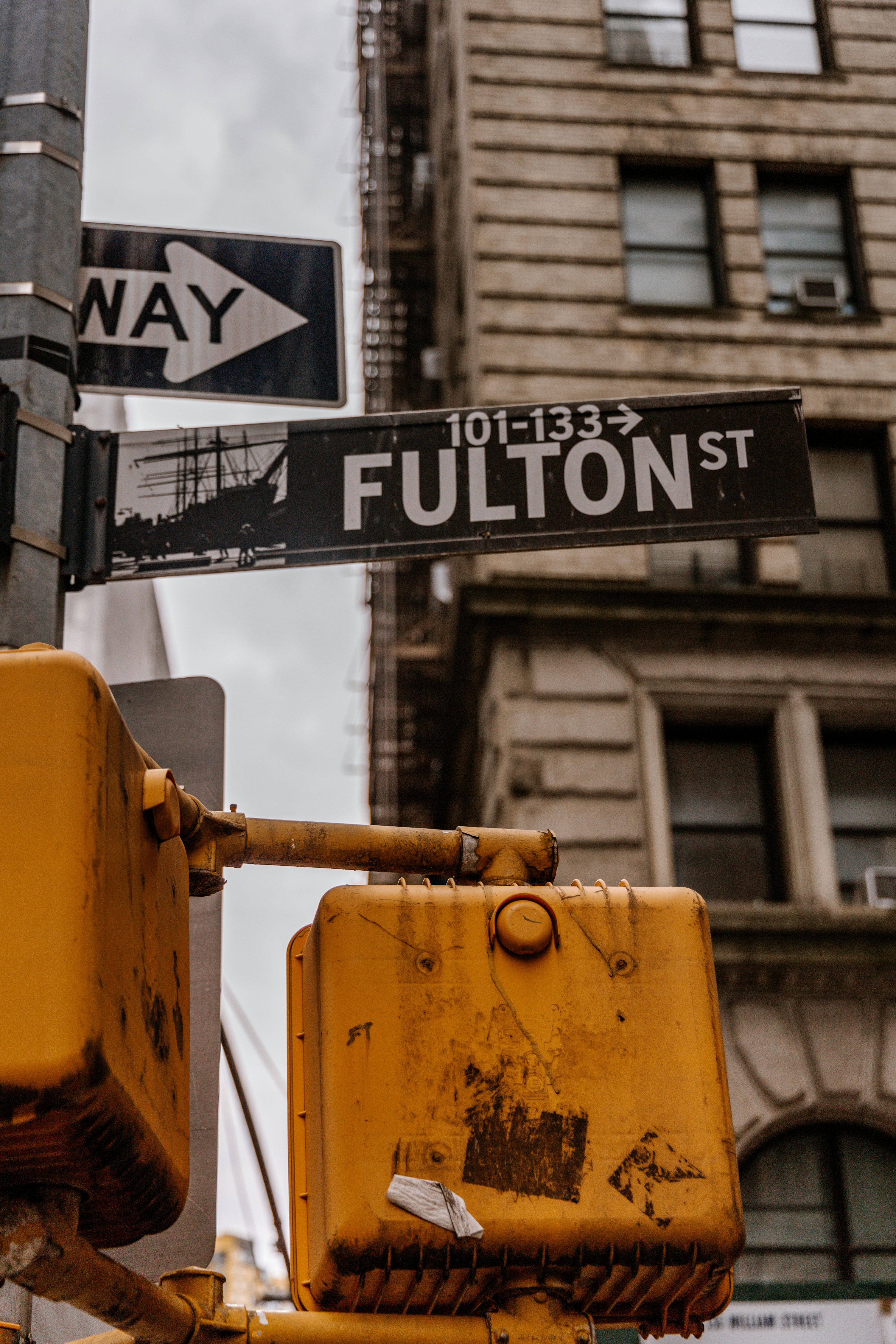 Fulton Street Sign at a Weathered Urban Intersection