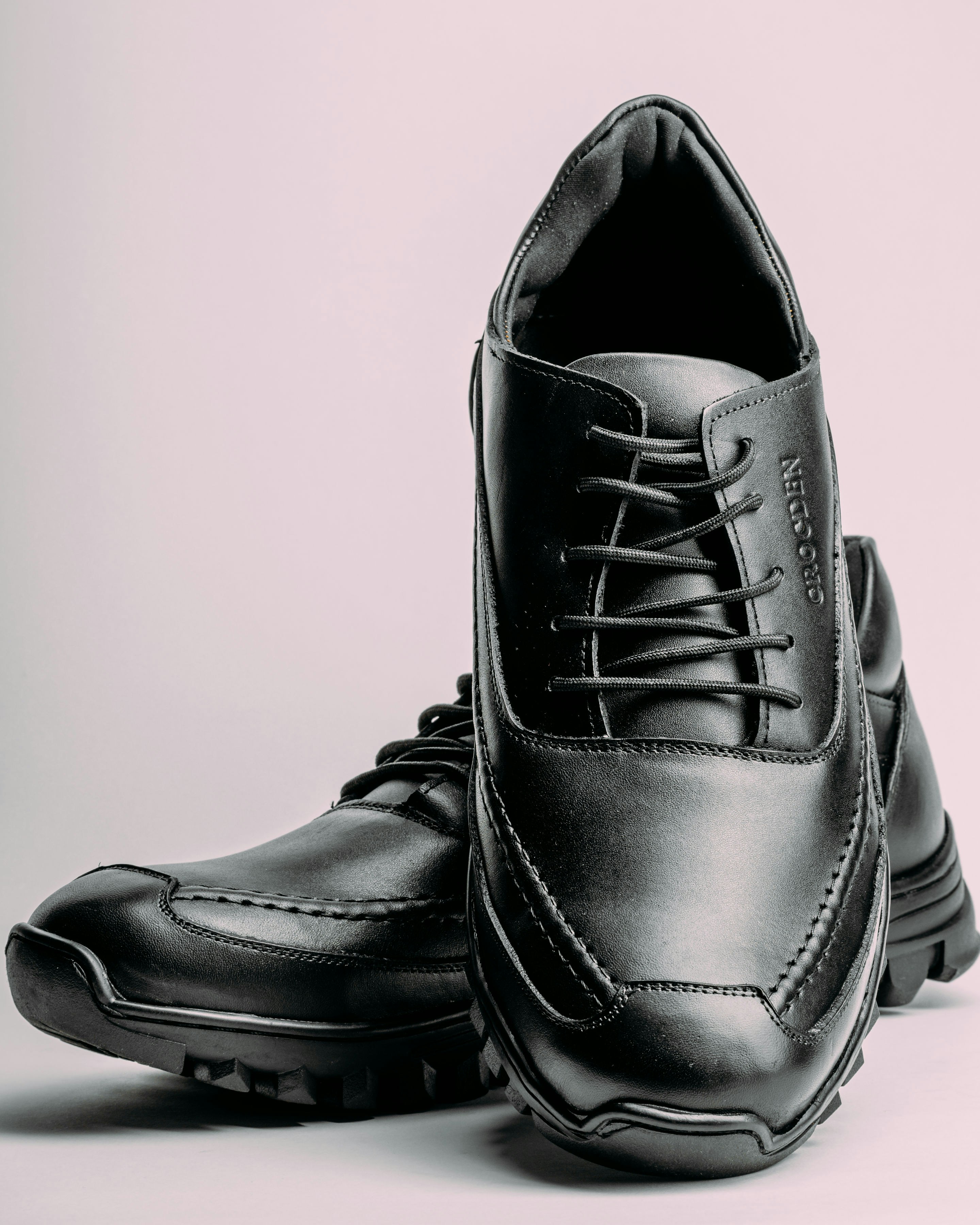 Mid-Shifted Steps: Close-Up of Polished Black Leather Shoes
