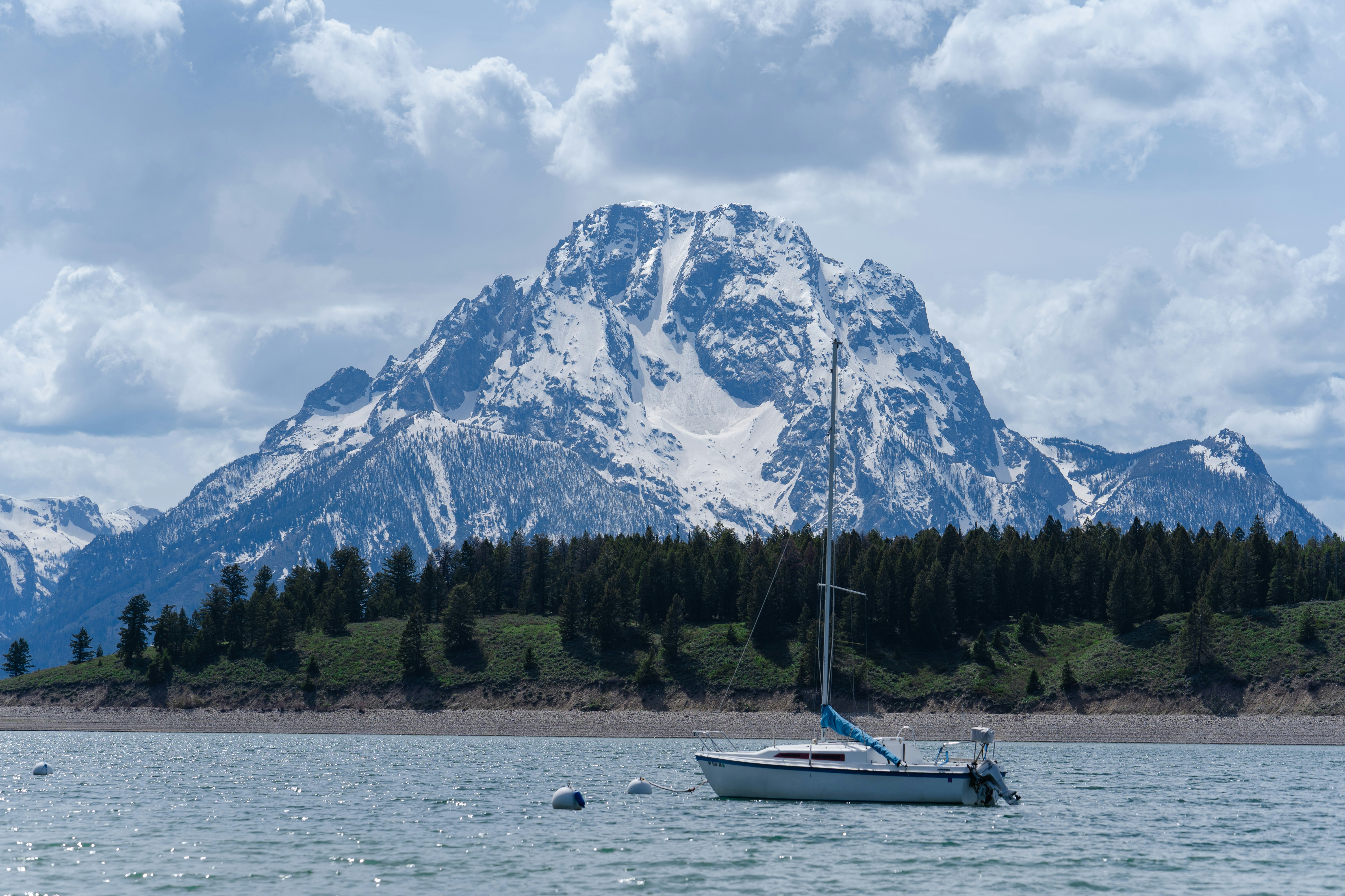 Sailboat at the Foot of a Snow-Capped Peak