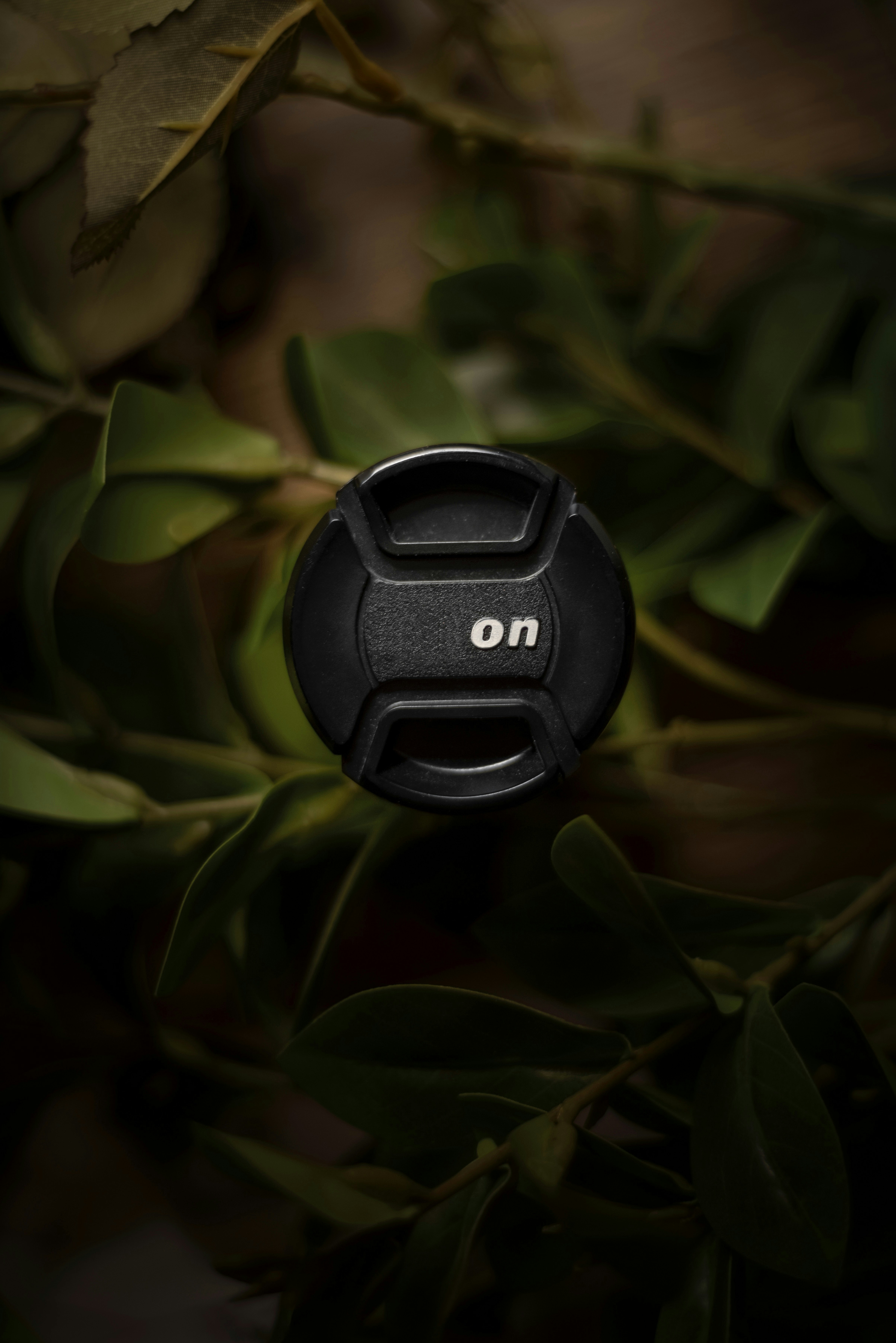A close up of a camera lens cap photo – Free Black Image on Unsplash