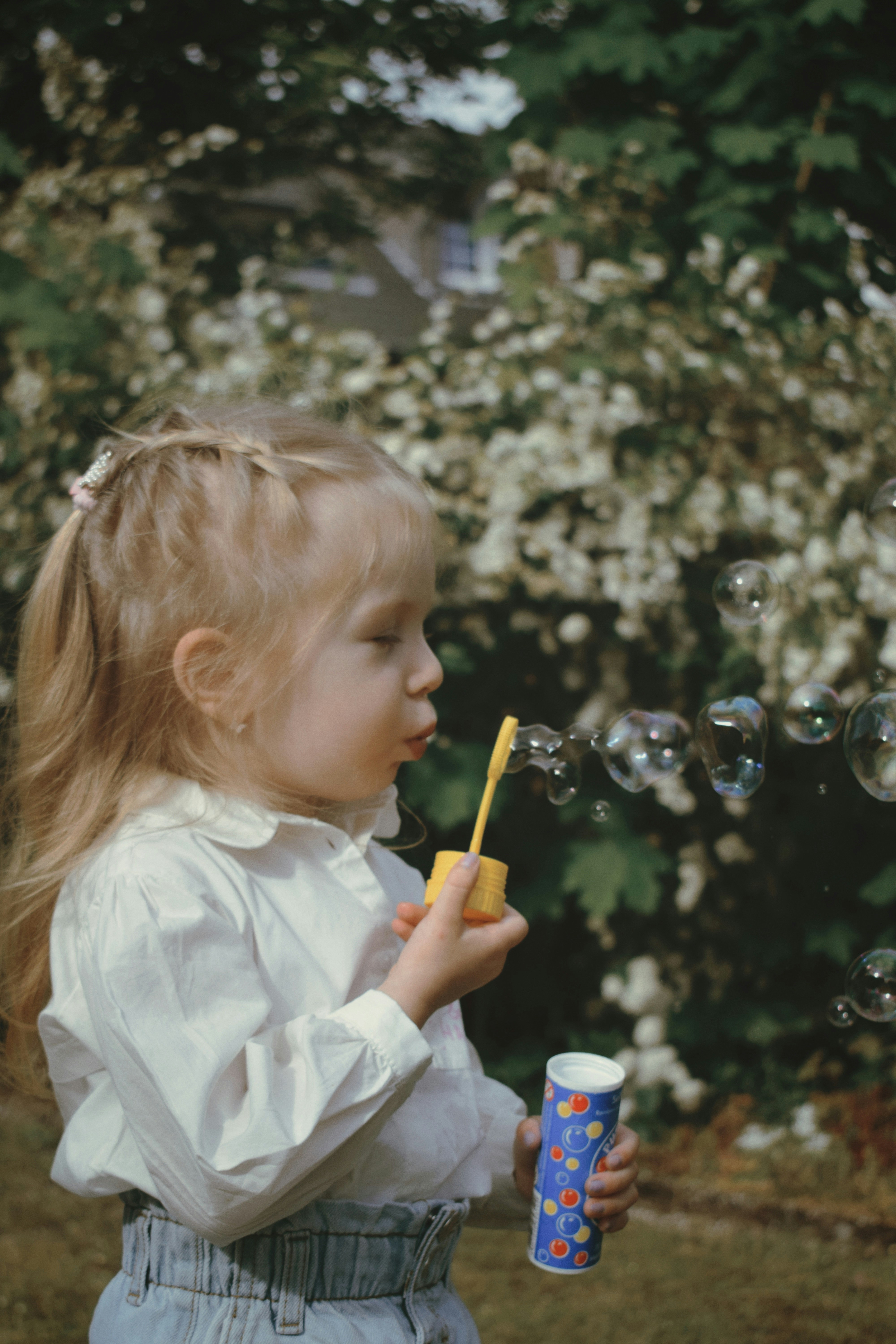 Bubble Drift in White: A Quiet Moment Among Spring Blossoms