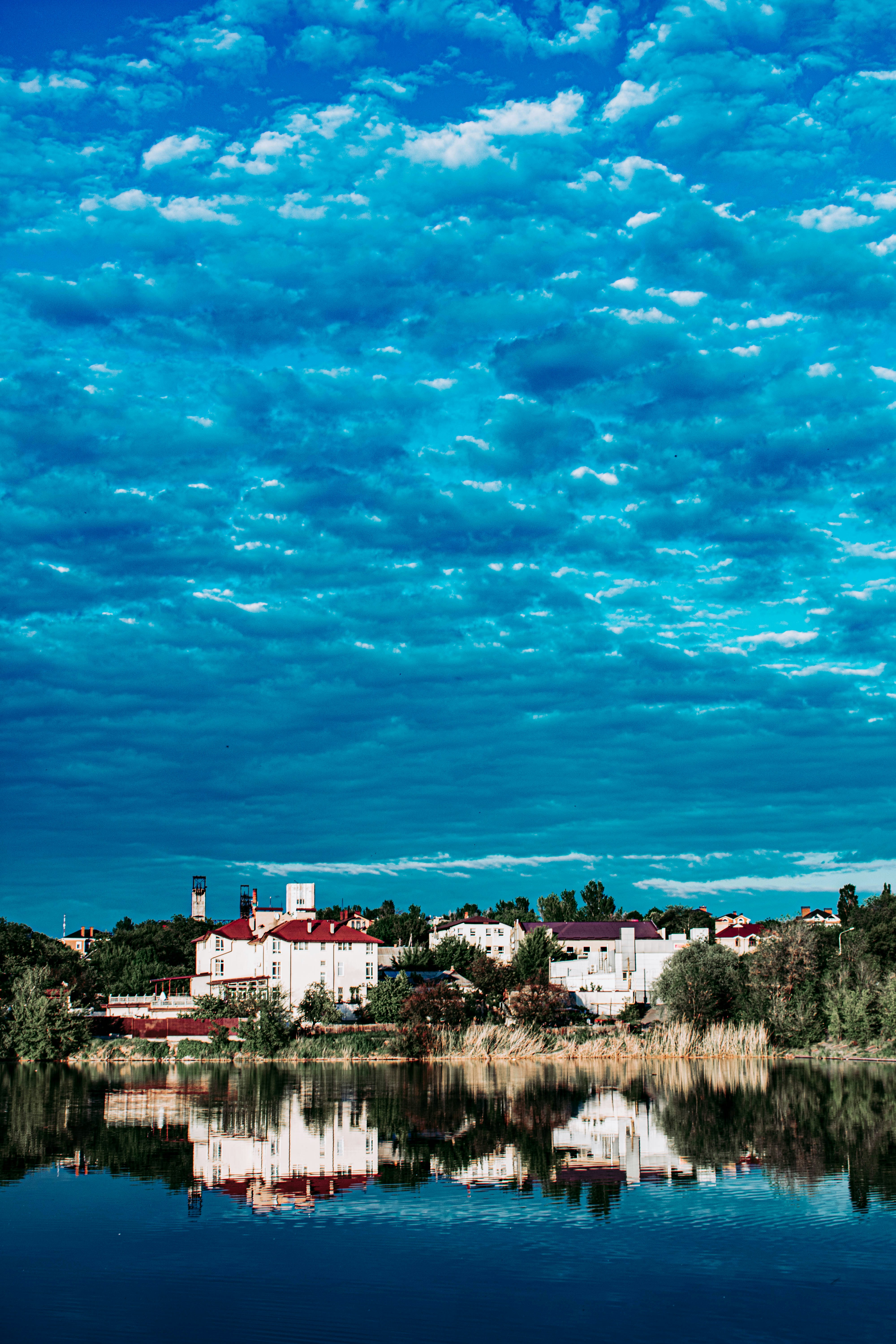 a large body of water with a city in the background