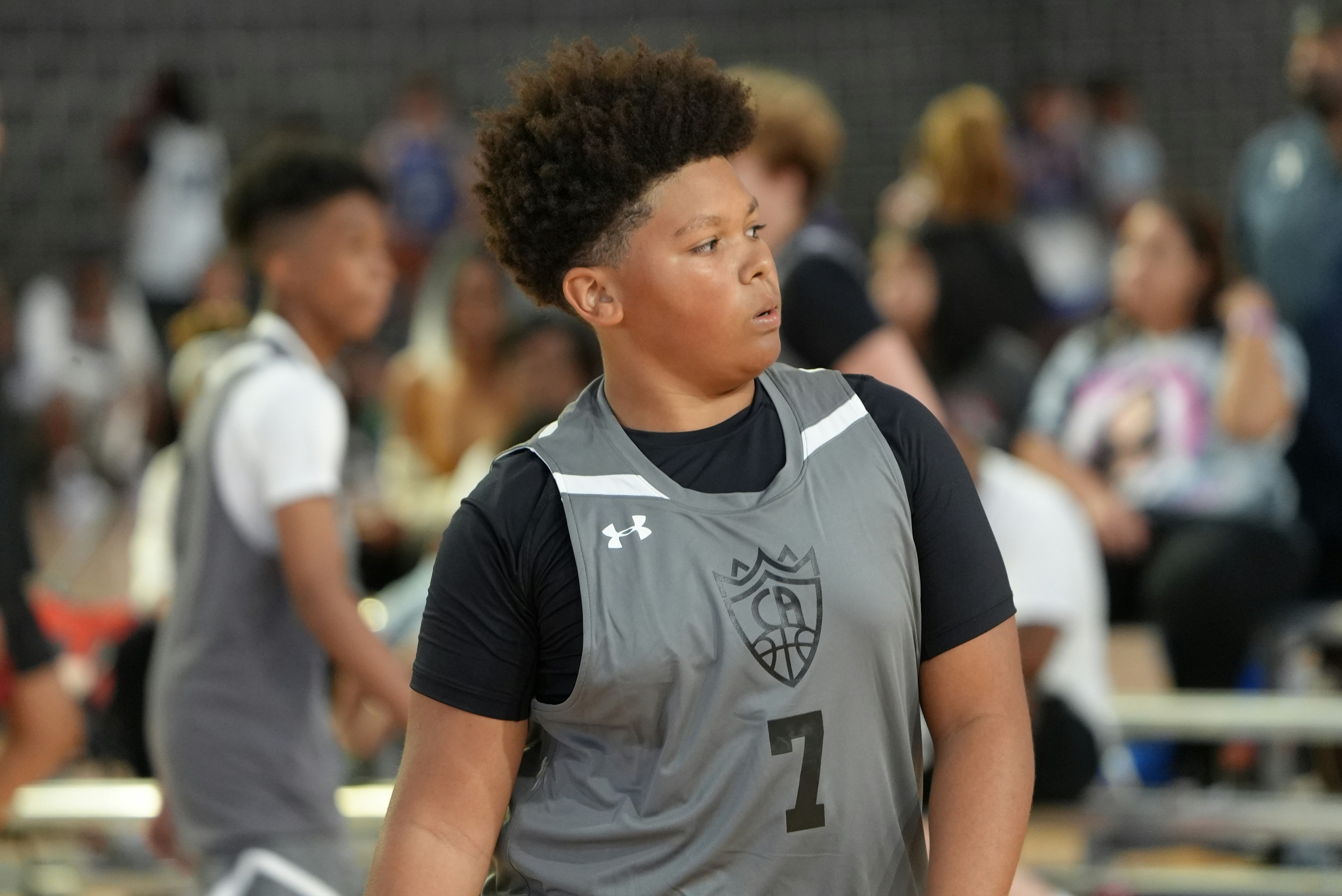 A group of young men playing a game of basketball photo – Free Aau ...
