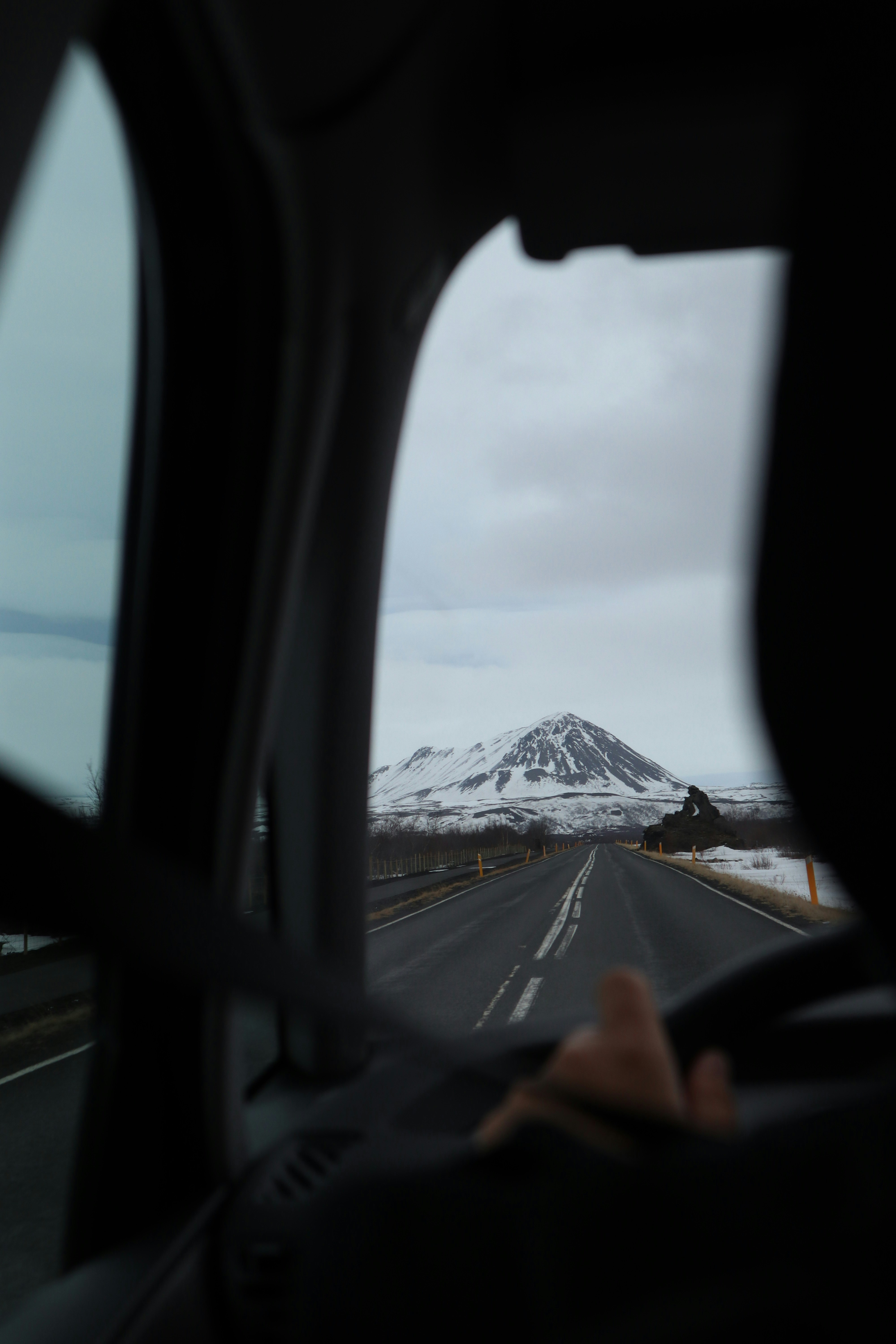 Snow-Capped Peak Through a Driver's Window