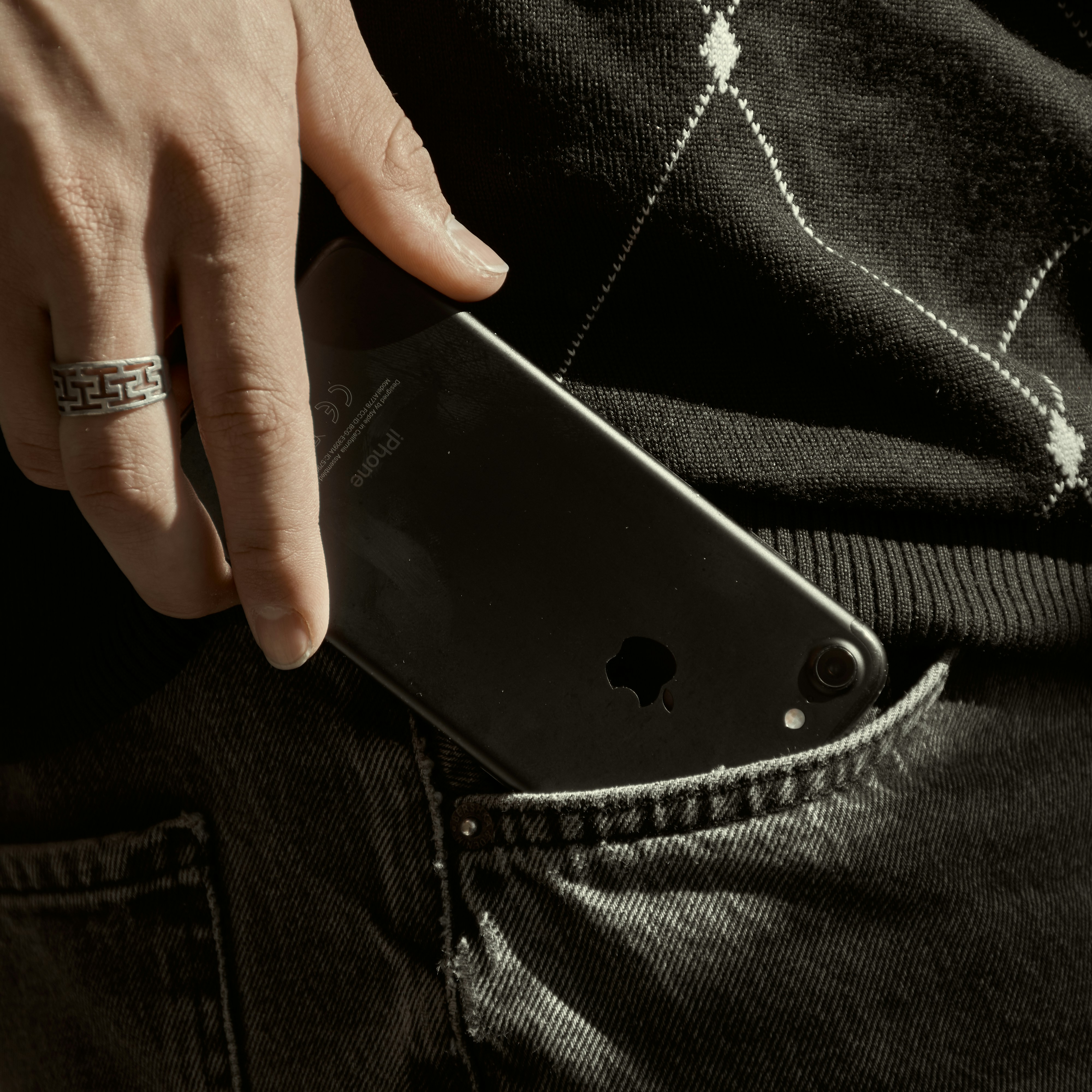 Pocketed Pixel: A Quiet Moment with a Smartphone Resting at the Hip
