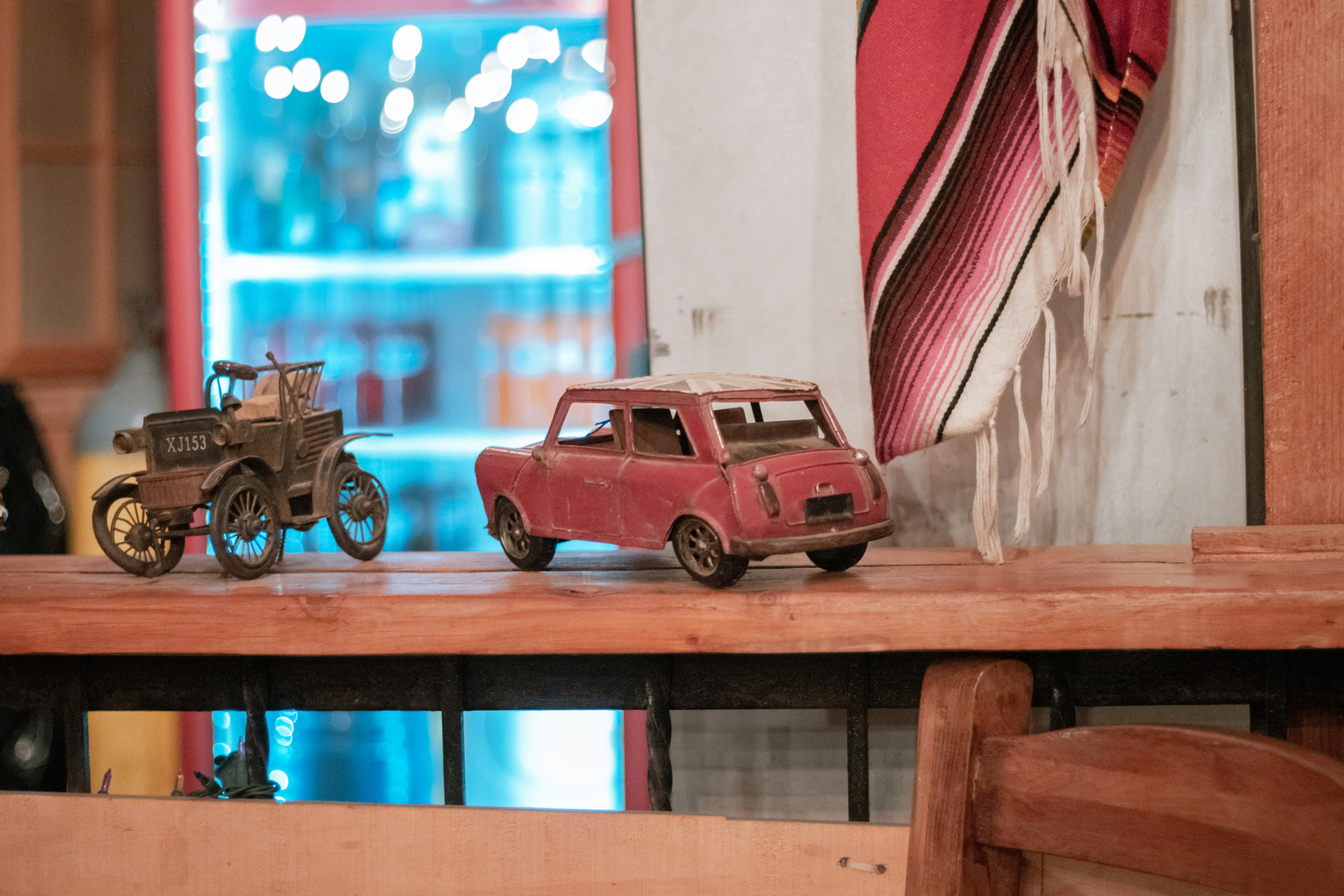 Miniature Roadshow on a Wooden Shelf