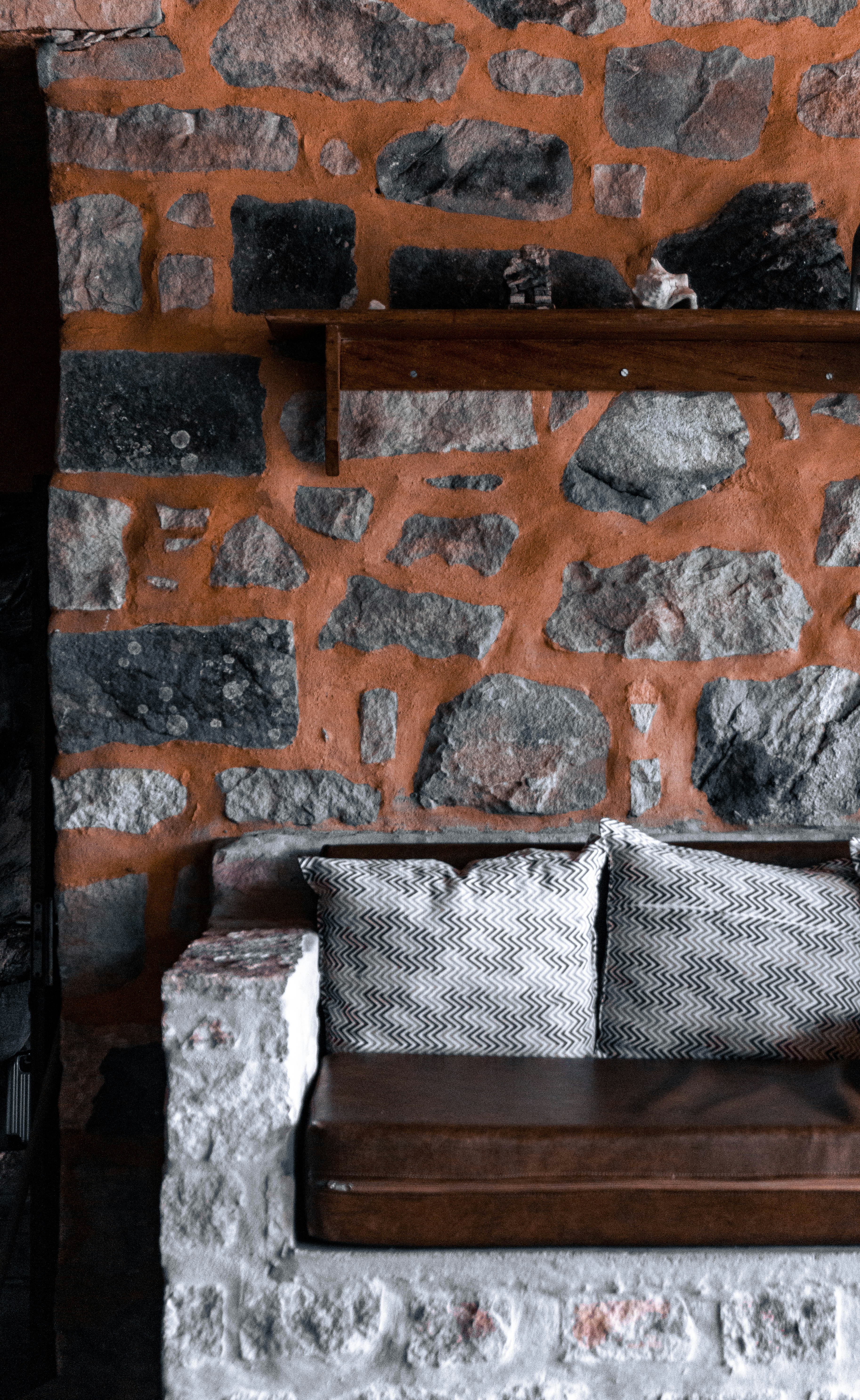 Chevron Cushions at the Edge of a Rugged Stone Nook