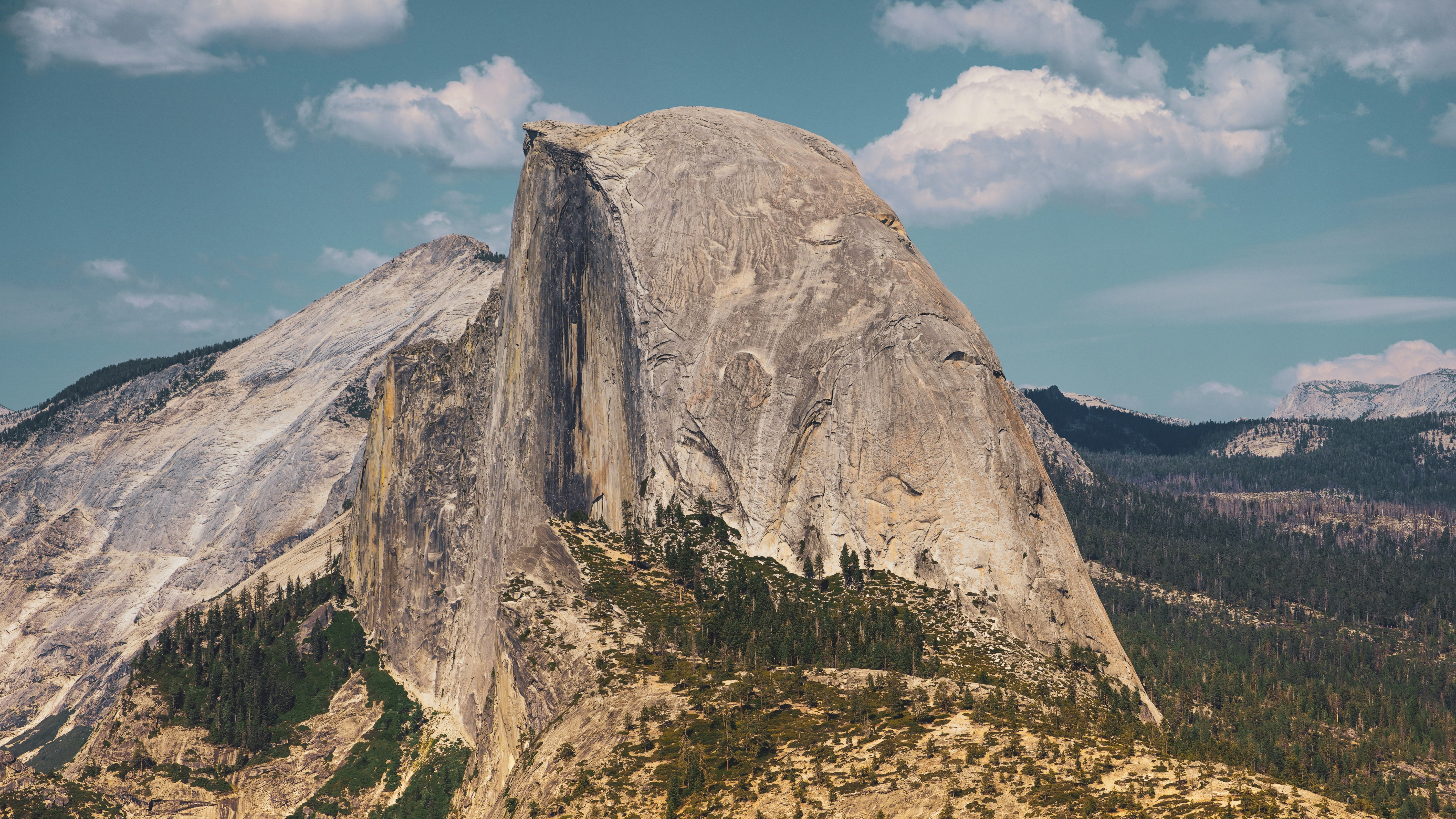 A large mountain with a very tall rock on top of it photo – Free ...