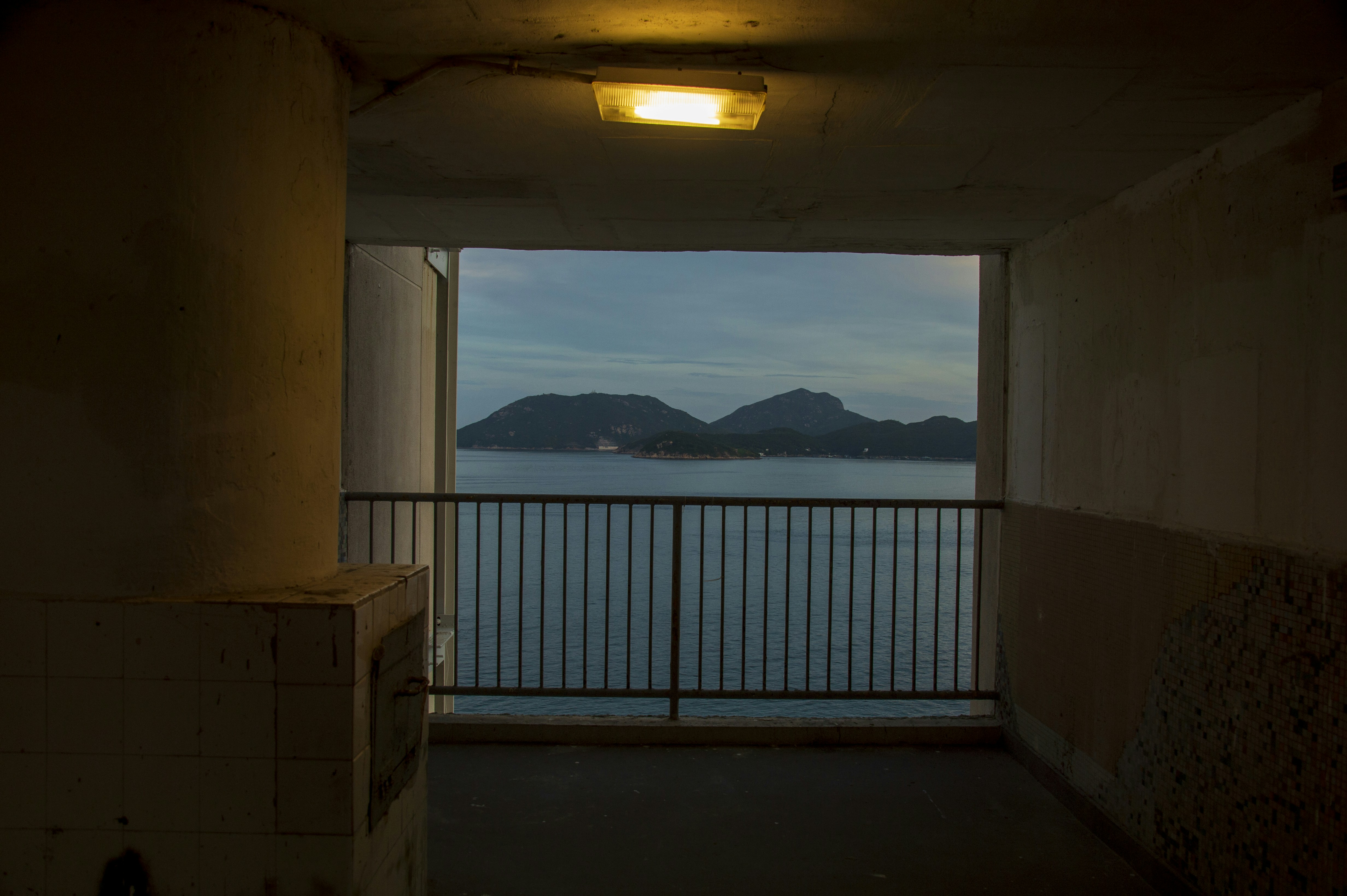 End of a corridor showing the blue sea