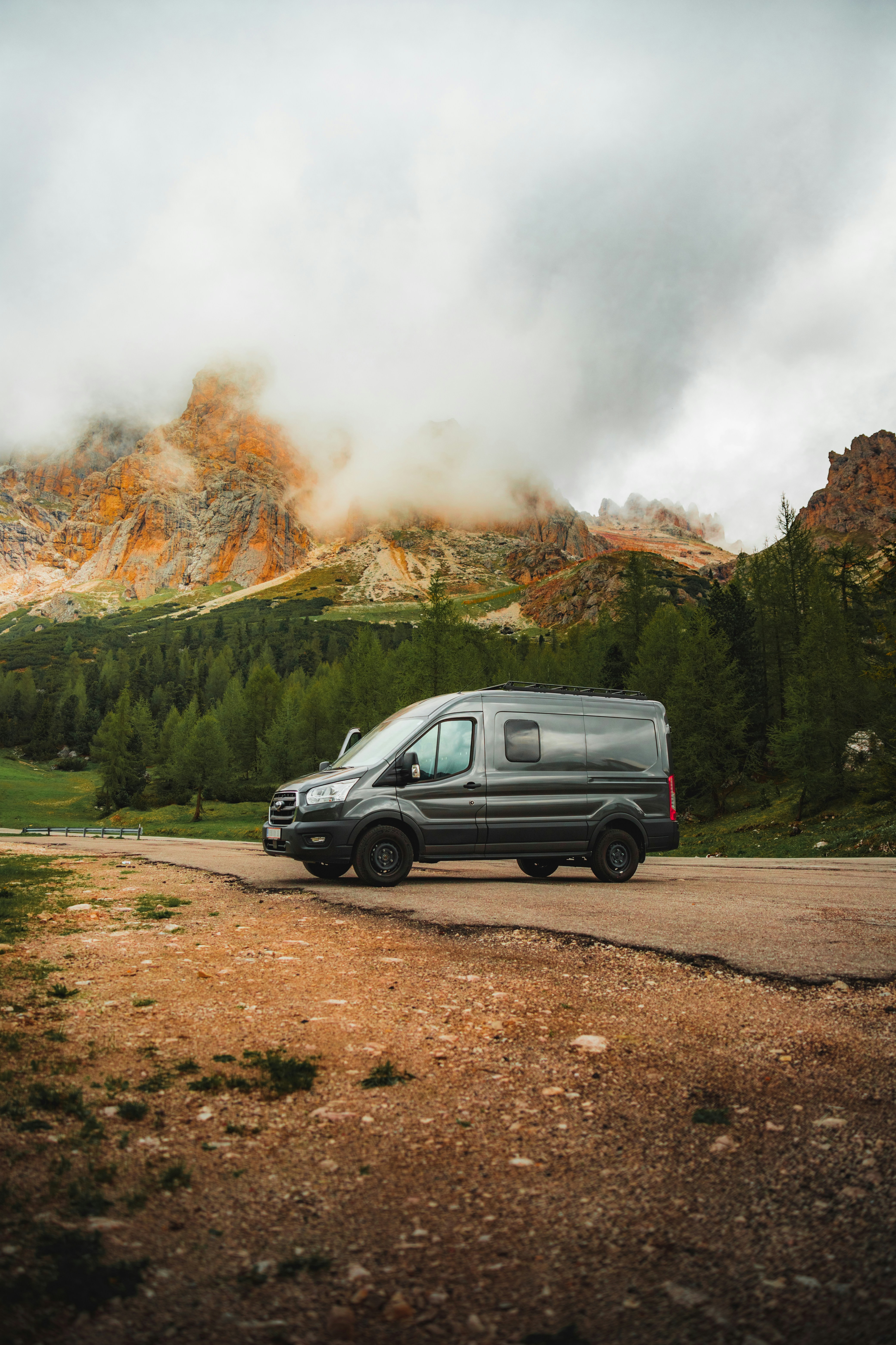 Vanlife in the Dolomites. 🚐🏔 | a van parked on the side of a dirt road