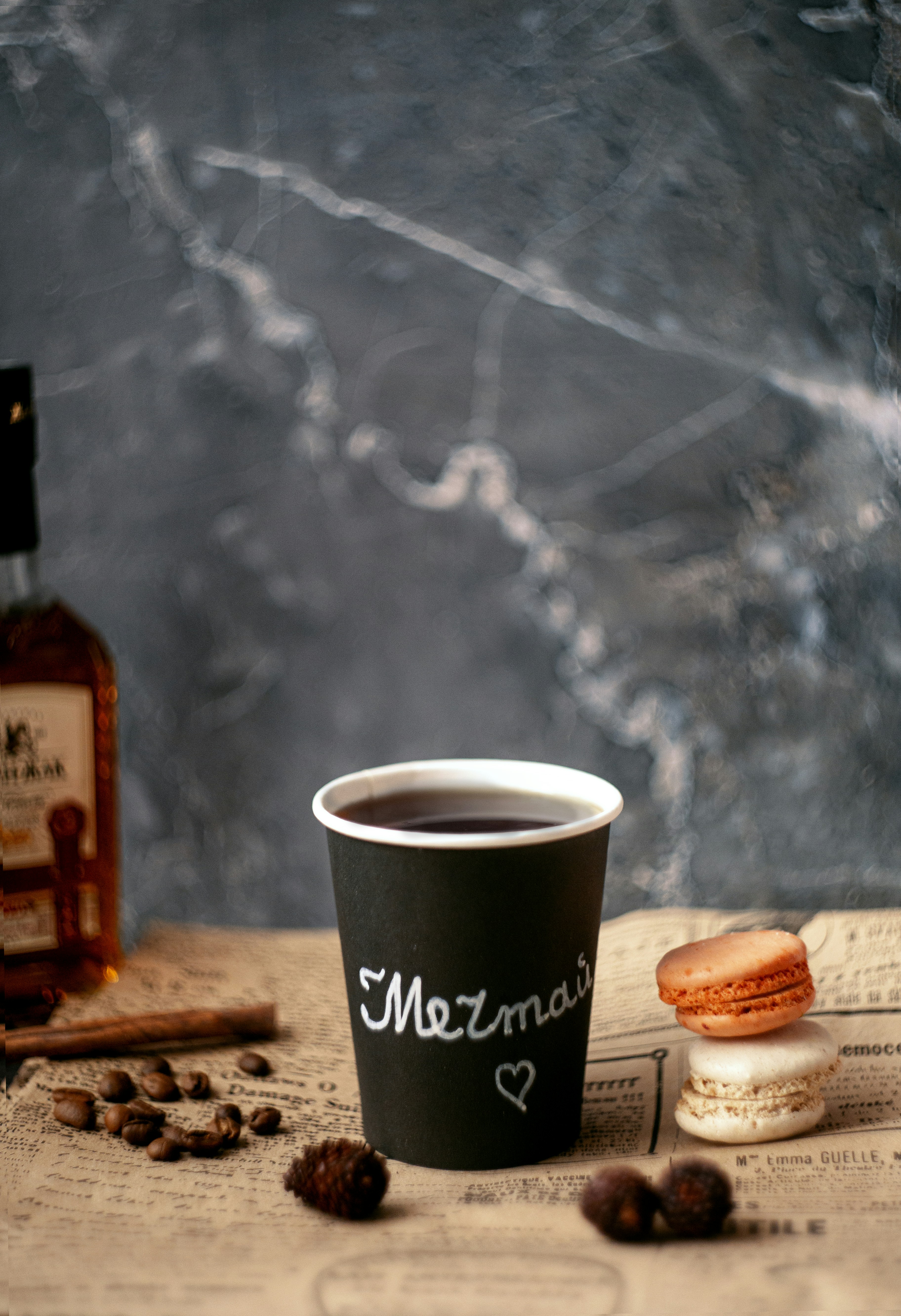 a cup of coffee sitting on top of a table