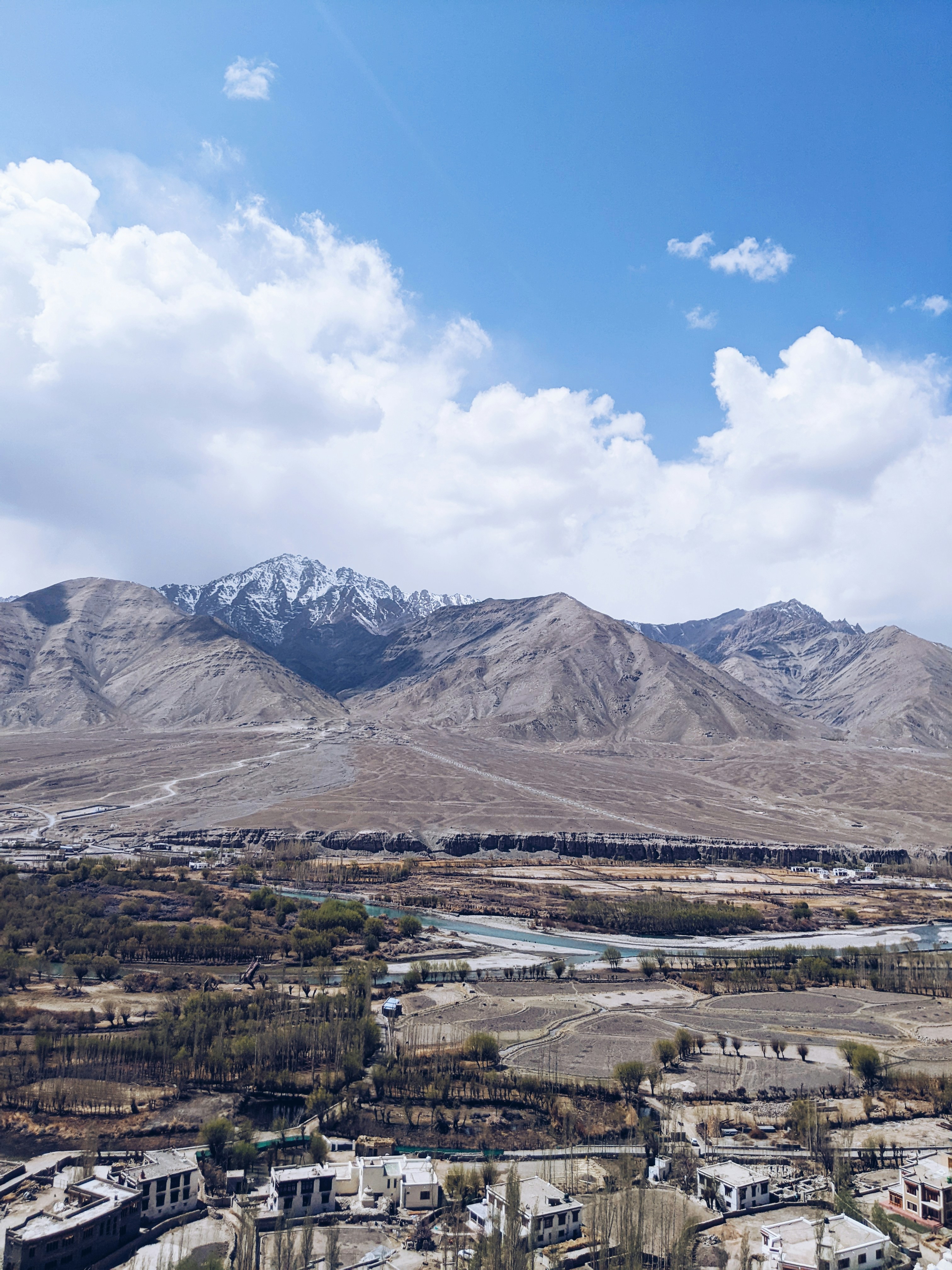 Ridge and River: Quiet Valley Beneath Snow-dusted Peaks