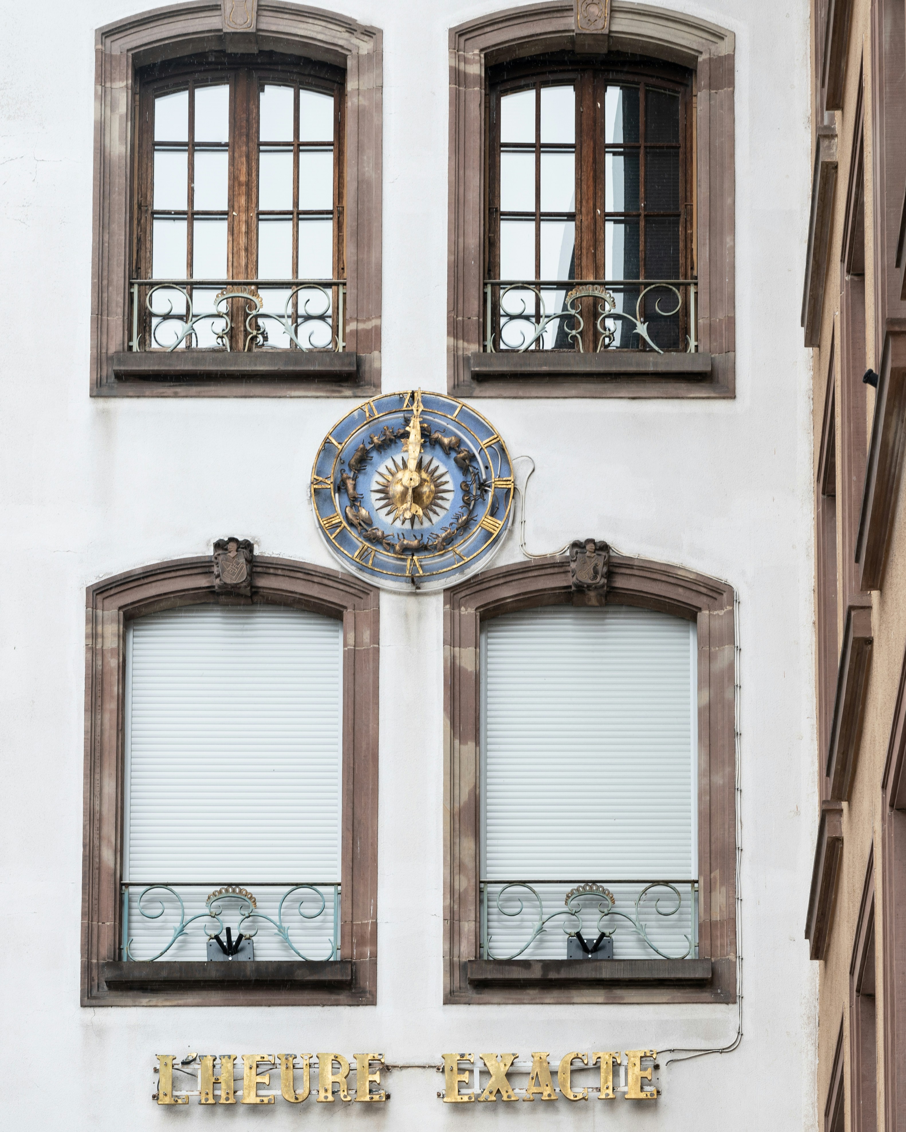 a clock mounted to the side of a building